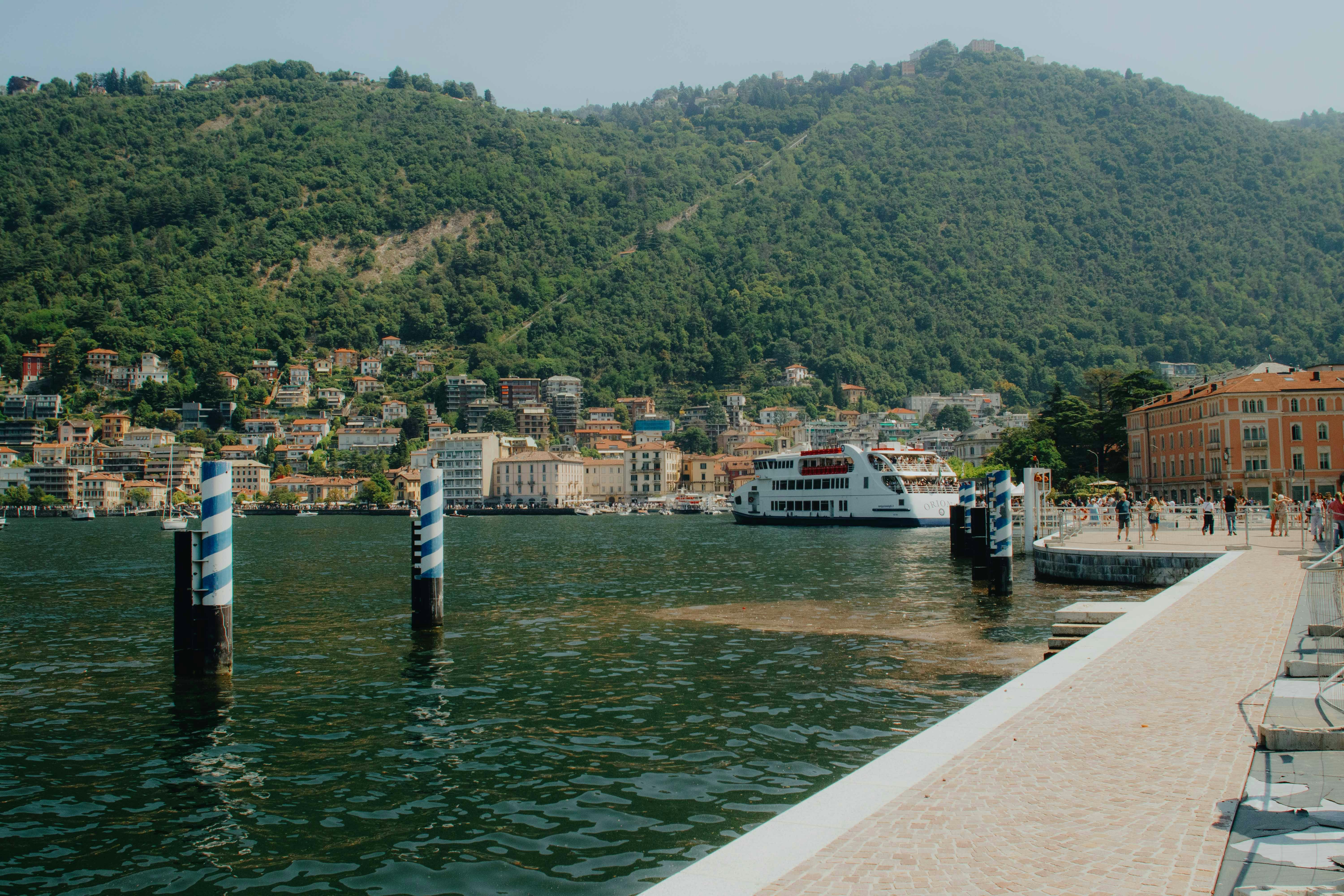 Harbor Promenade with Ferry at the Foot of Green Hills