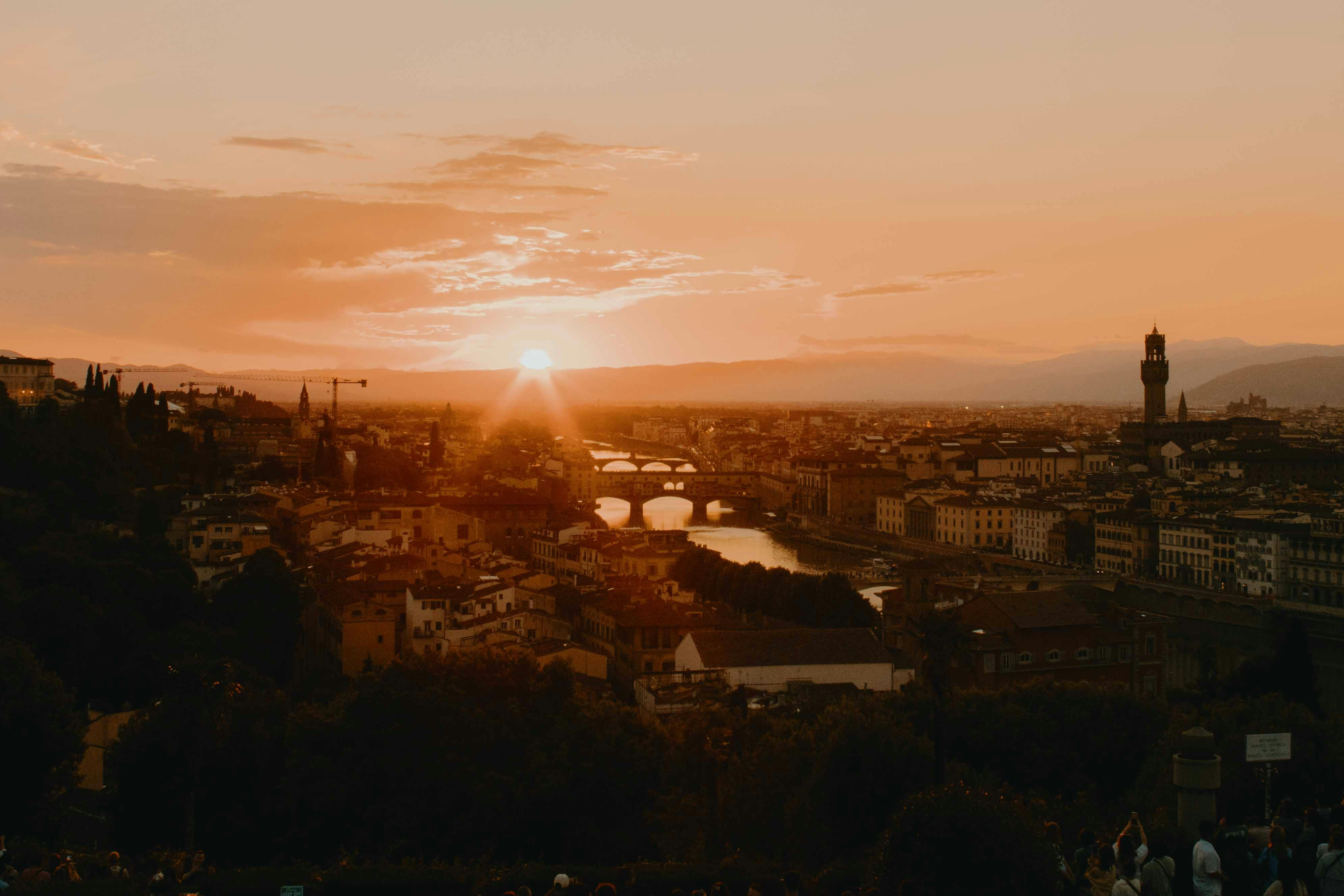 Sunset Over the River Arno: A Gilded Cityscape