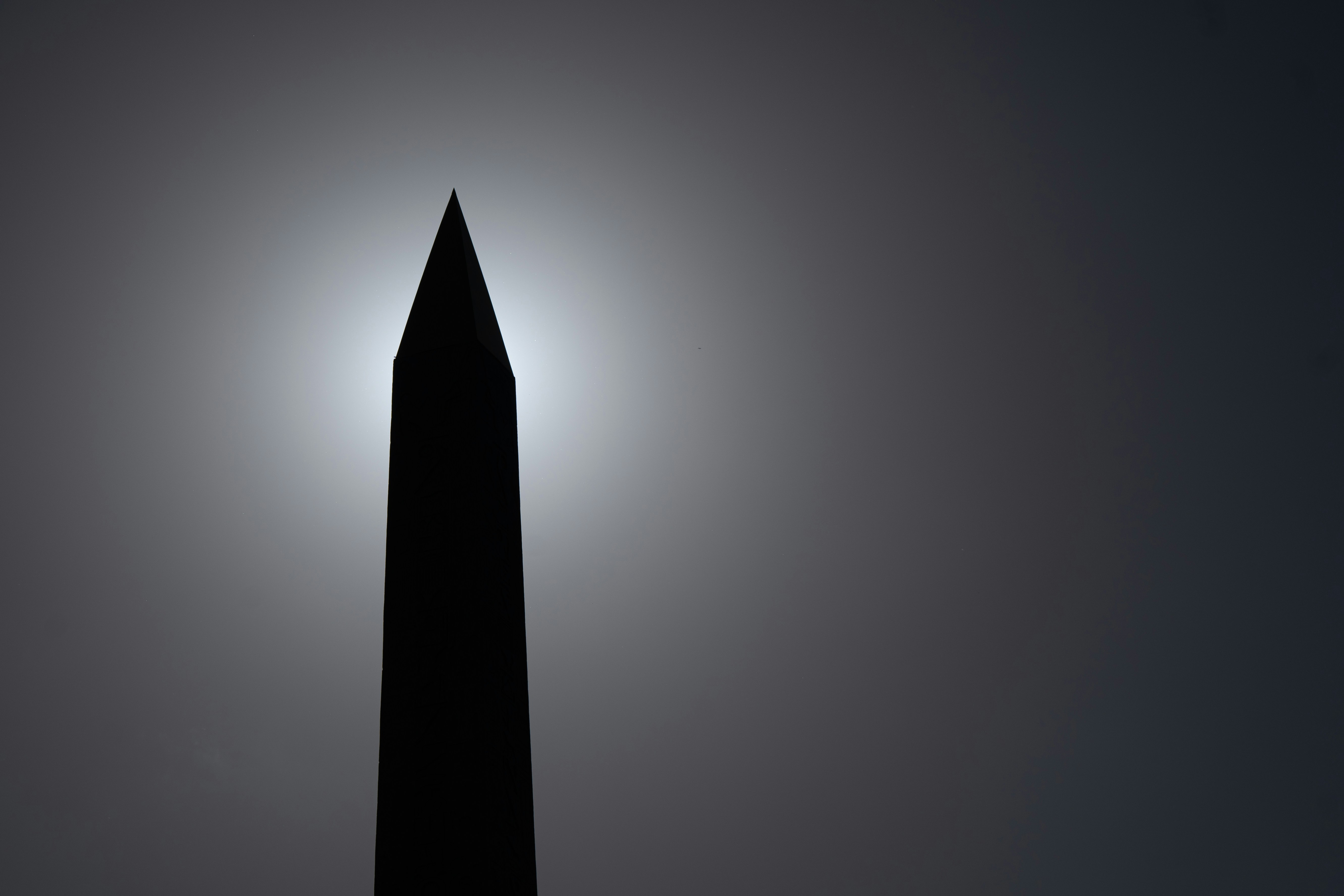 Silhouette of a Monument Reaching into the Evening Sky