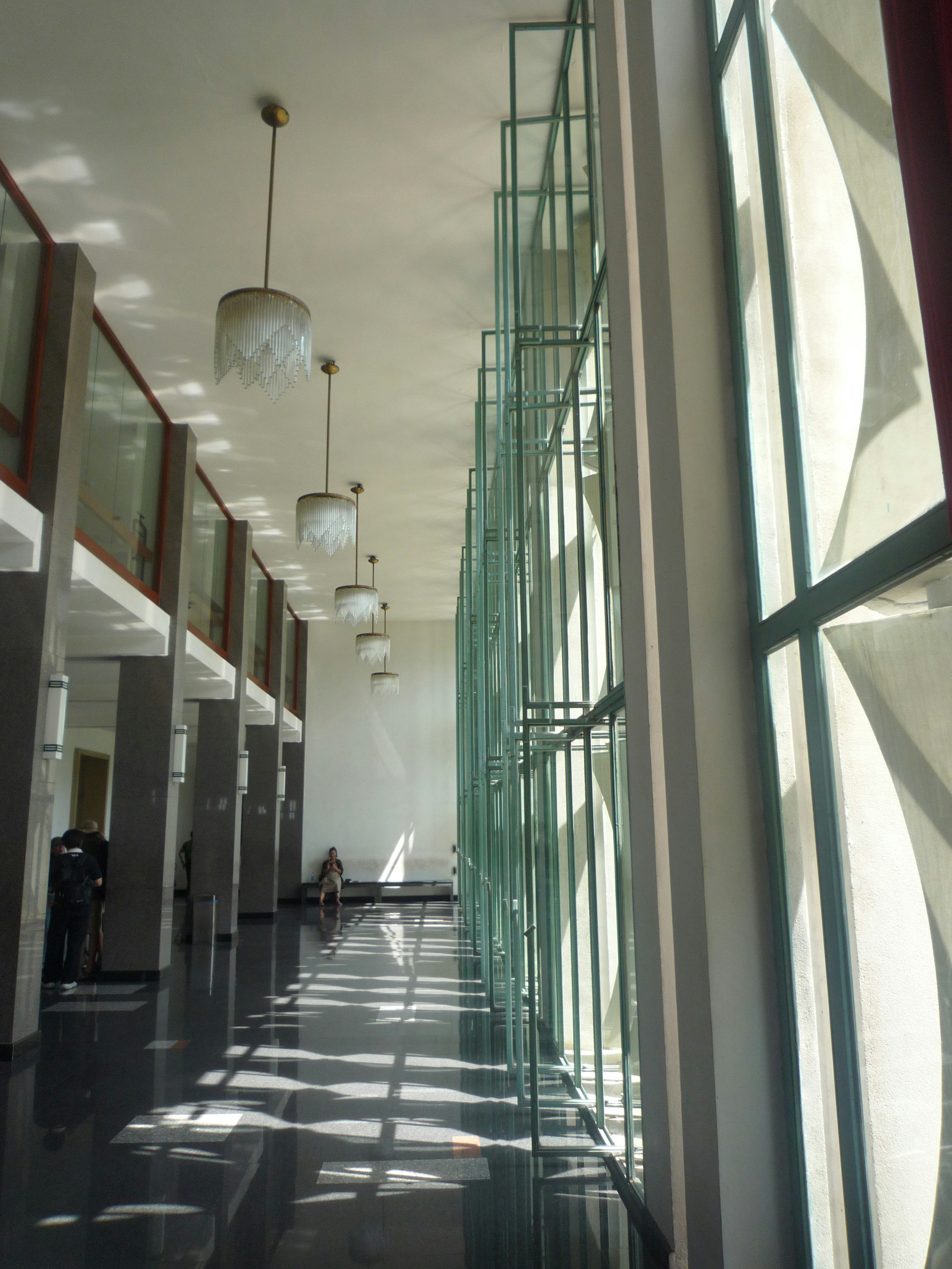 Glass-walled Atrium Corridor Bathed in Afternoon Light