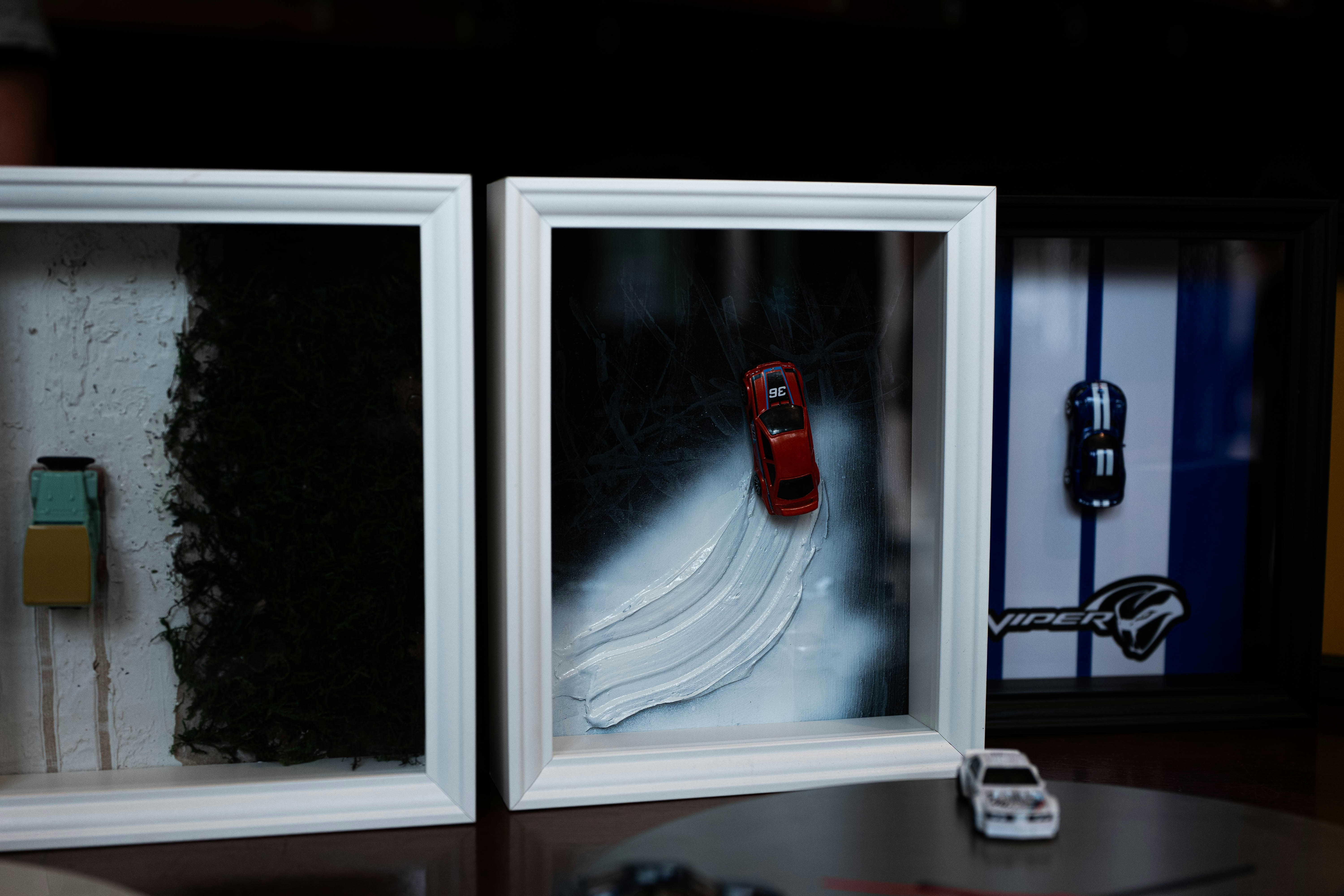Miniature Drift: Red Car Skips the Frame in a Tri-Panel Display