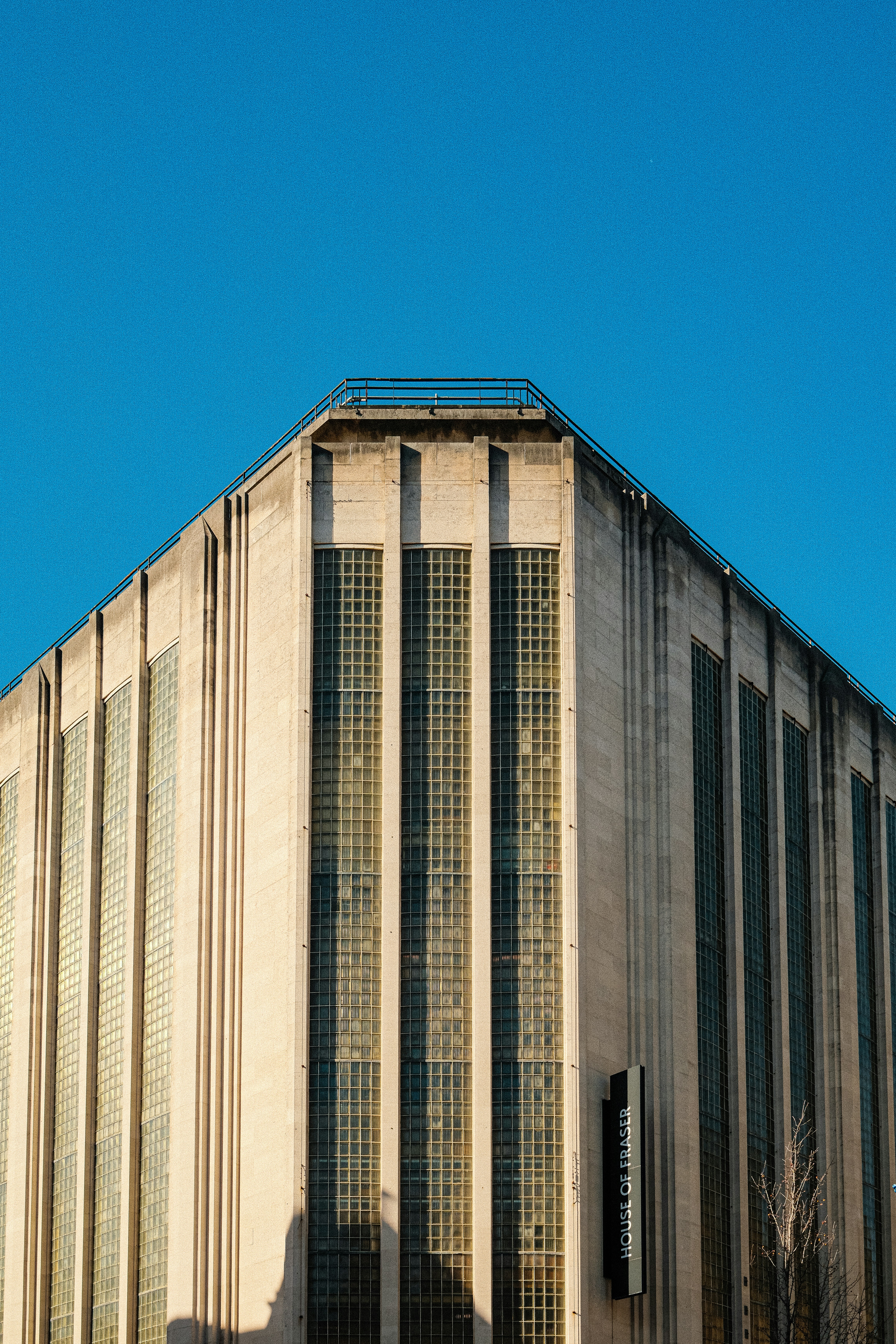 Vertical Industrial Facade Under a Clear Blue Sky