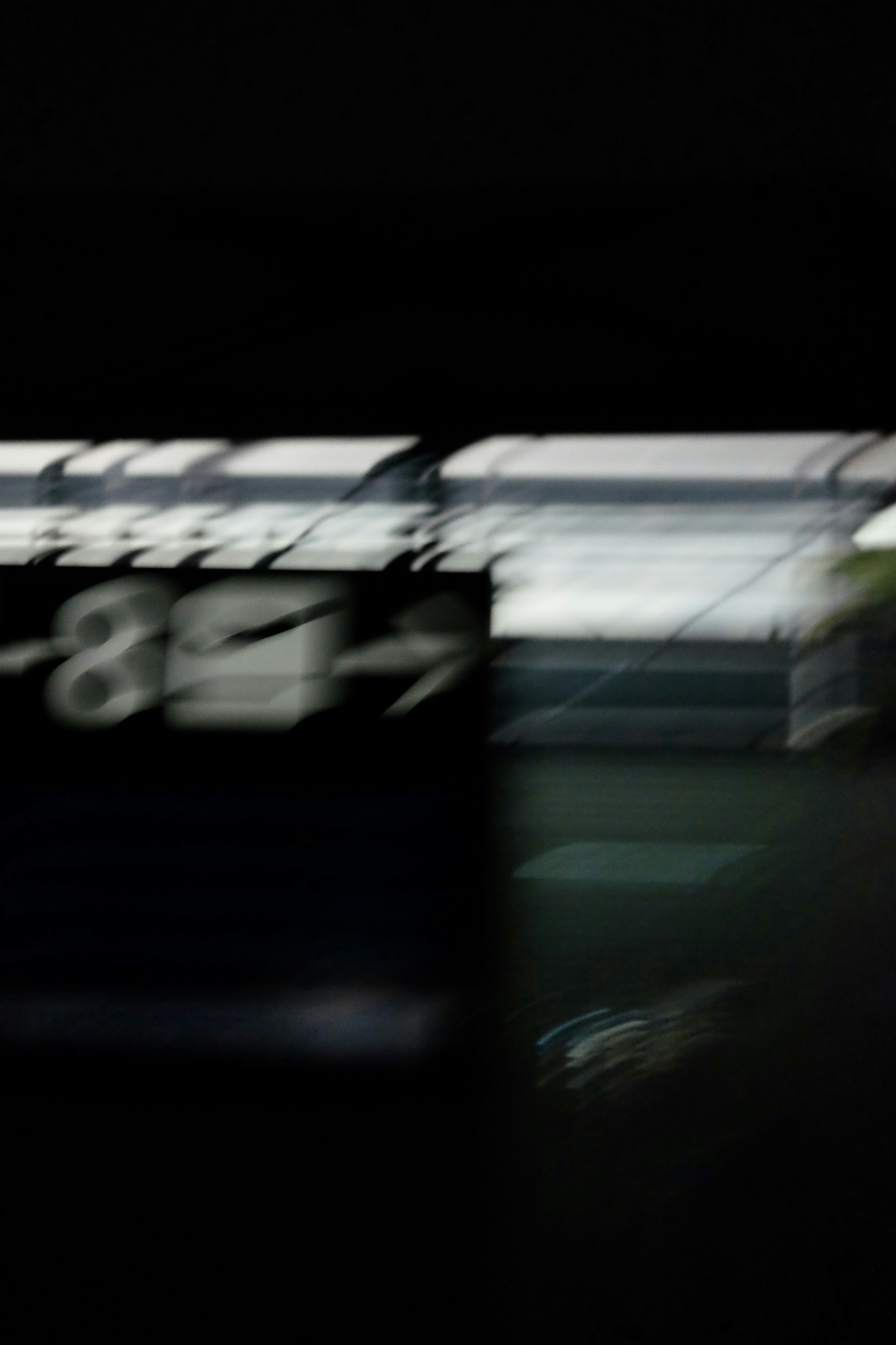 Blurred Stage Lights and Shadowed Structure in Motion