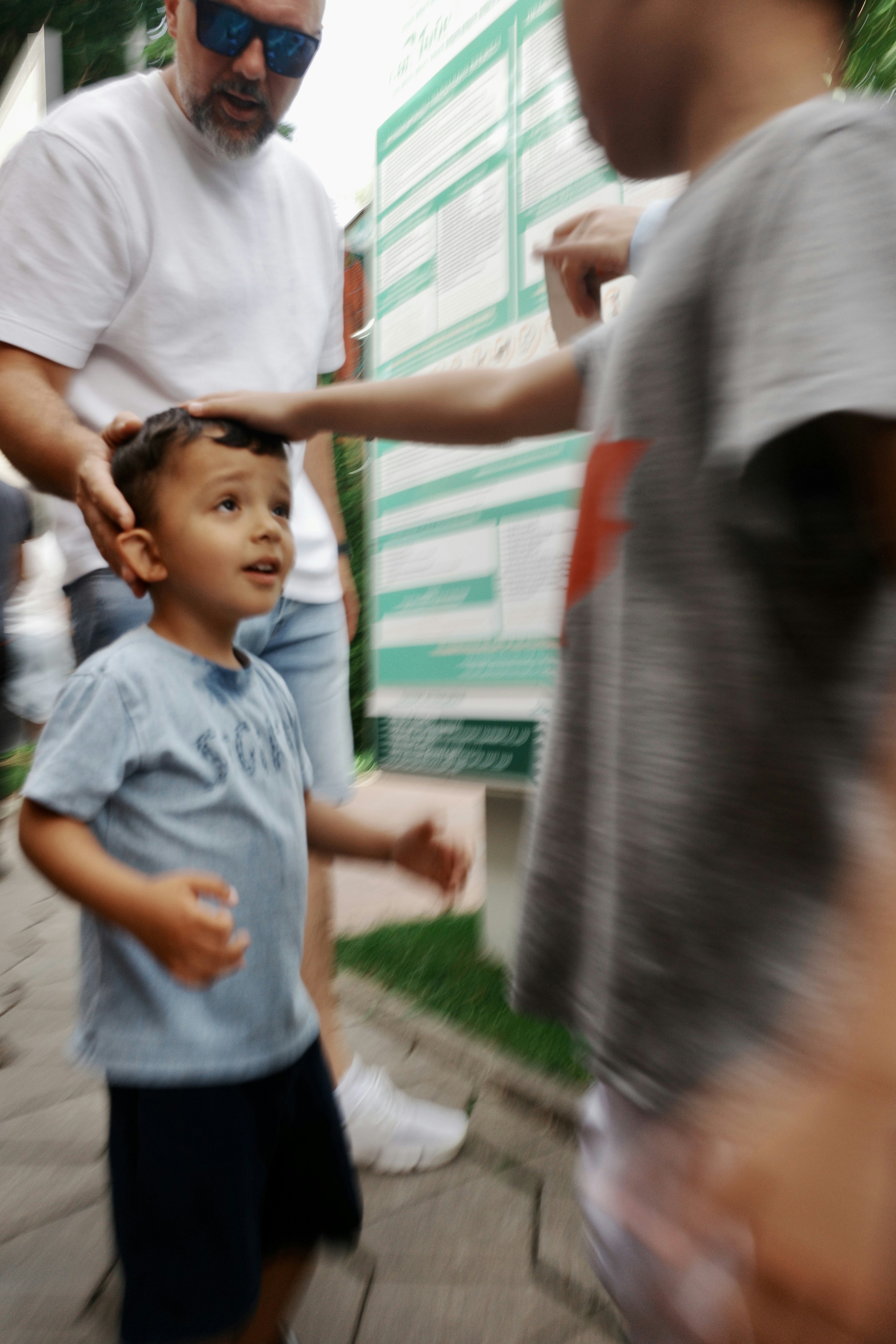 Curious Moment: A Little Explorer Engages with an Older Gentle Hand