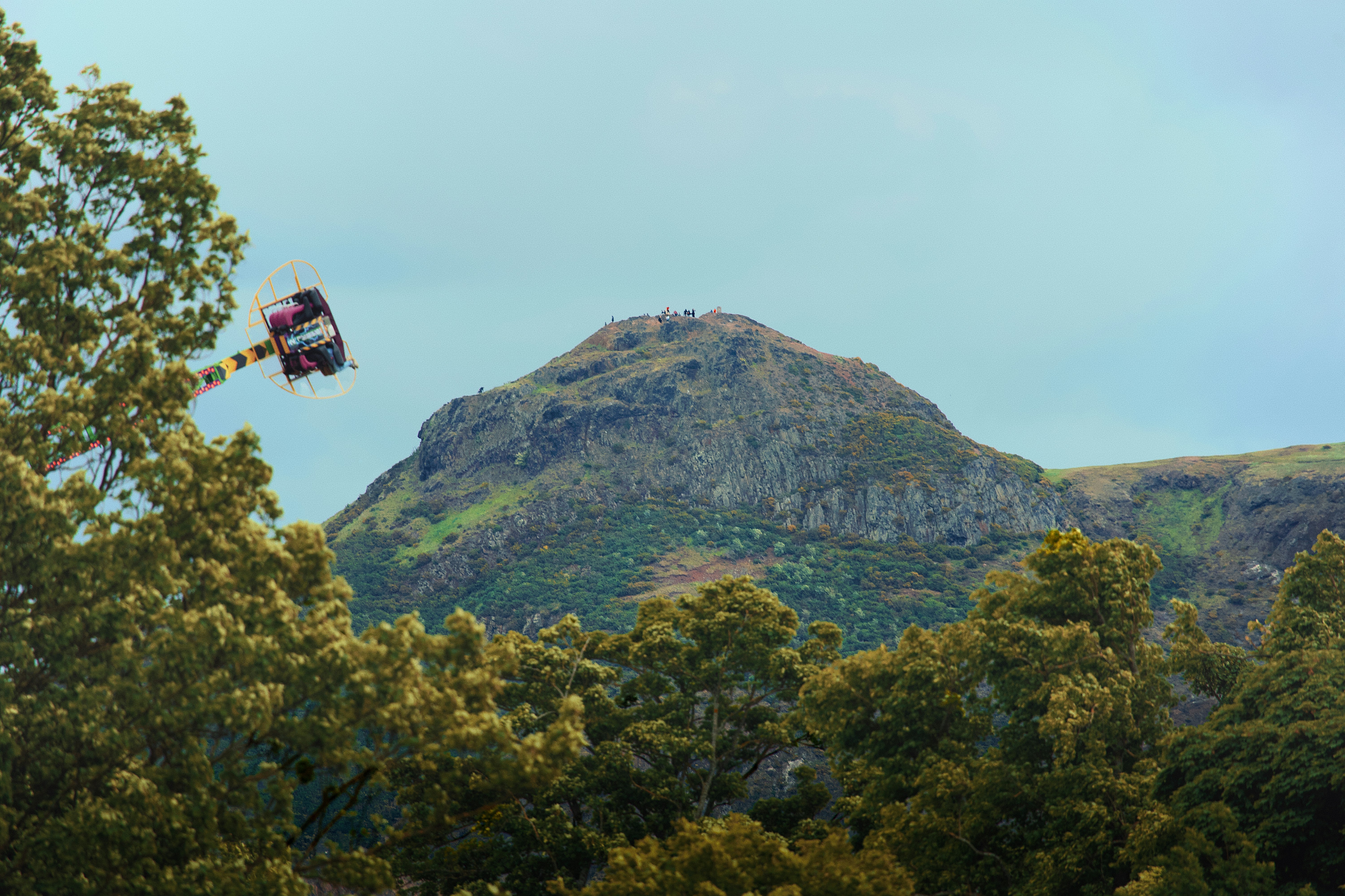 High Altitude Lift: A Cable Car Trekker Over a Verdant Ridge