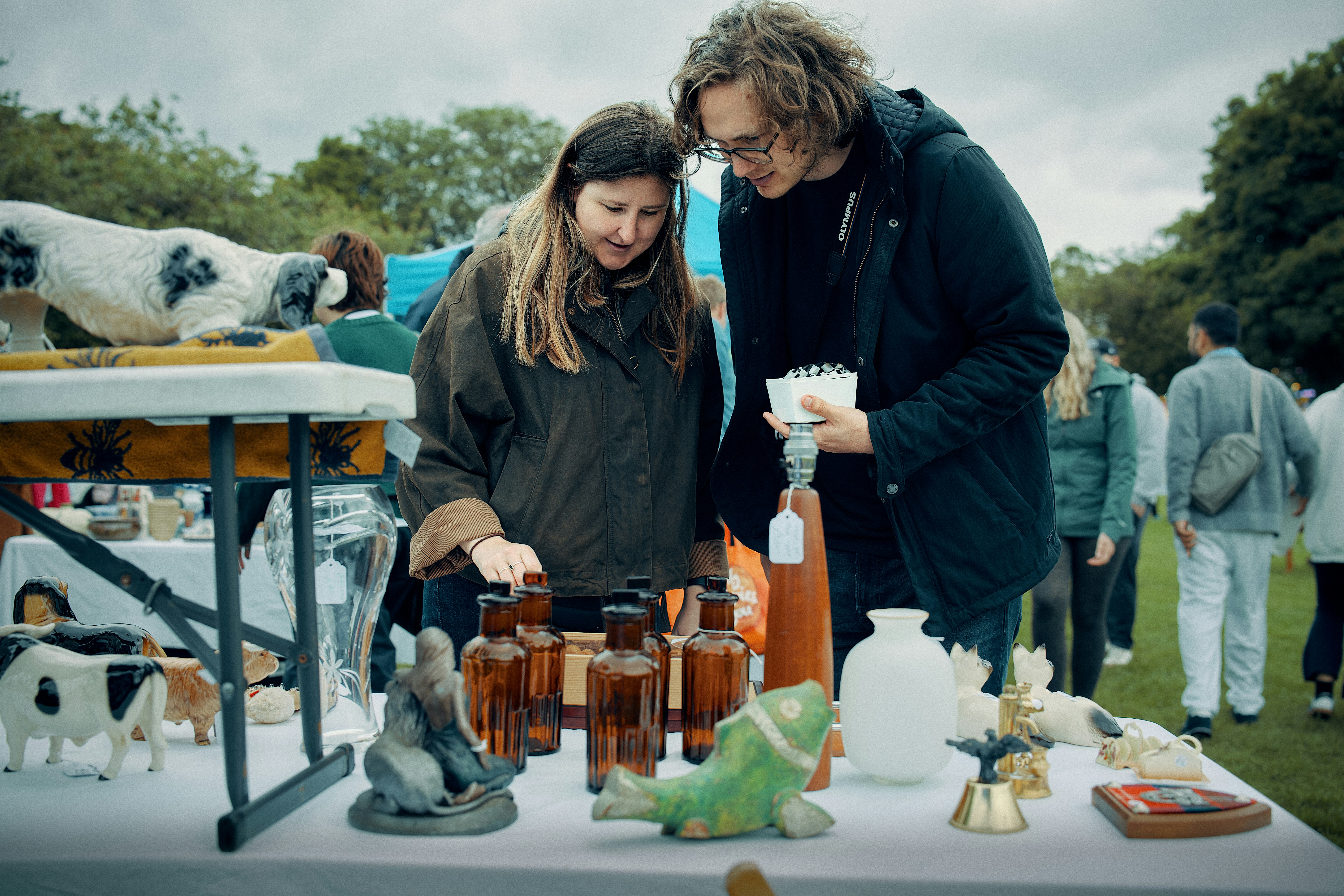 Market Table of Trinkets: A Shared Moment at the Outdoor Swap Meet