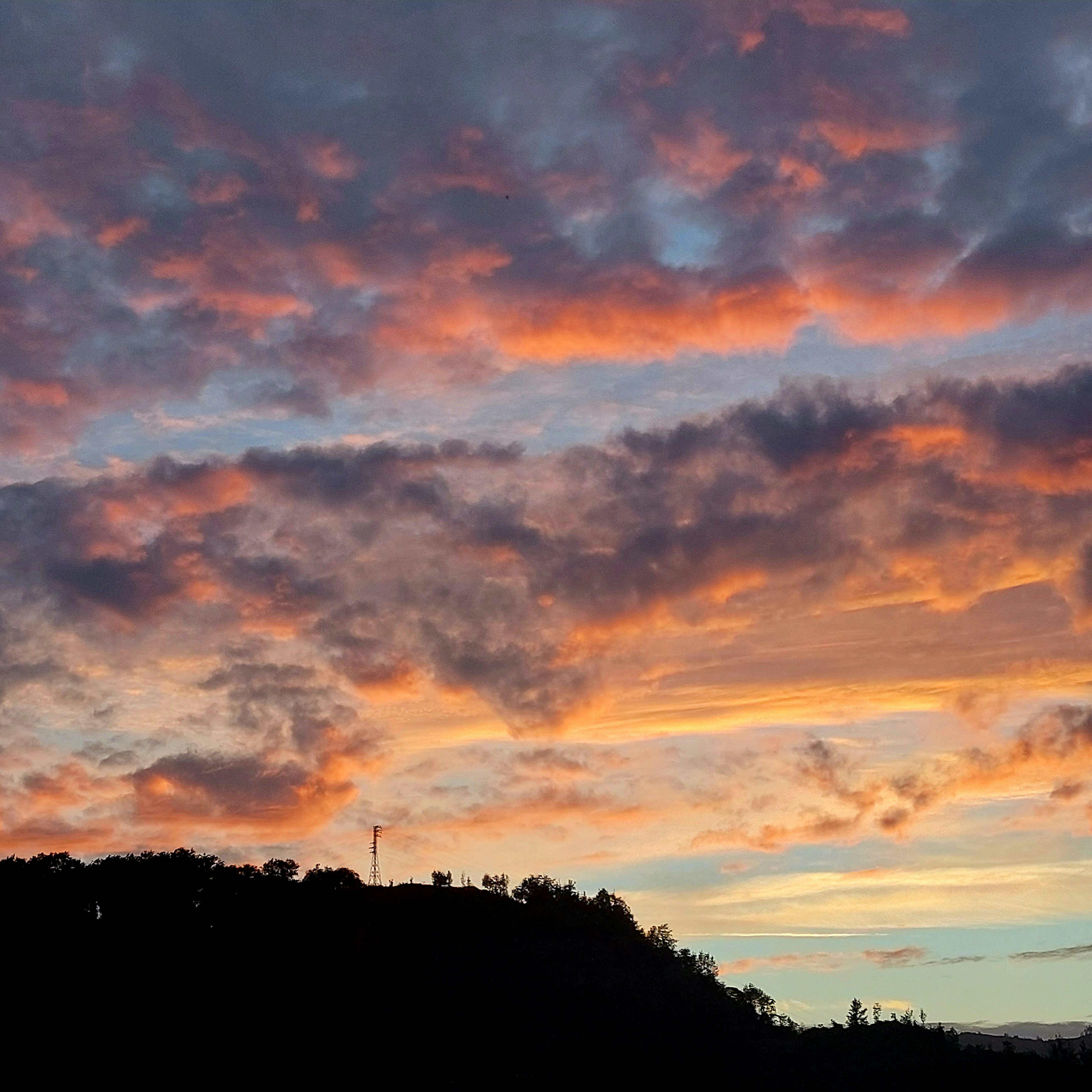 Horizon Fire: Sunset Traces Over Quiet Crest