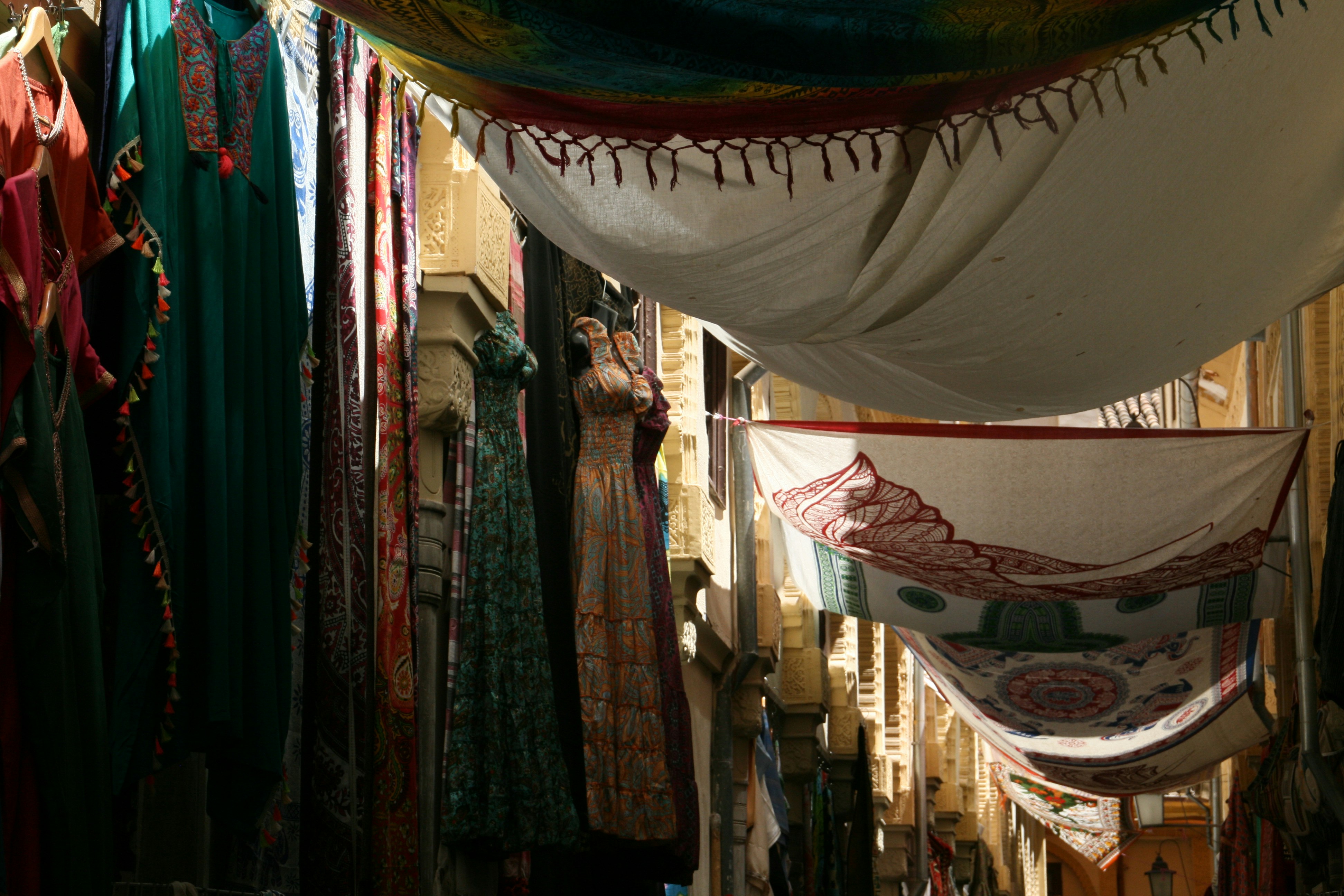 Sari-lined Alleyway Under Colorful Canopy