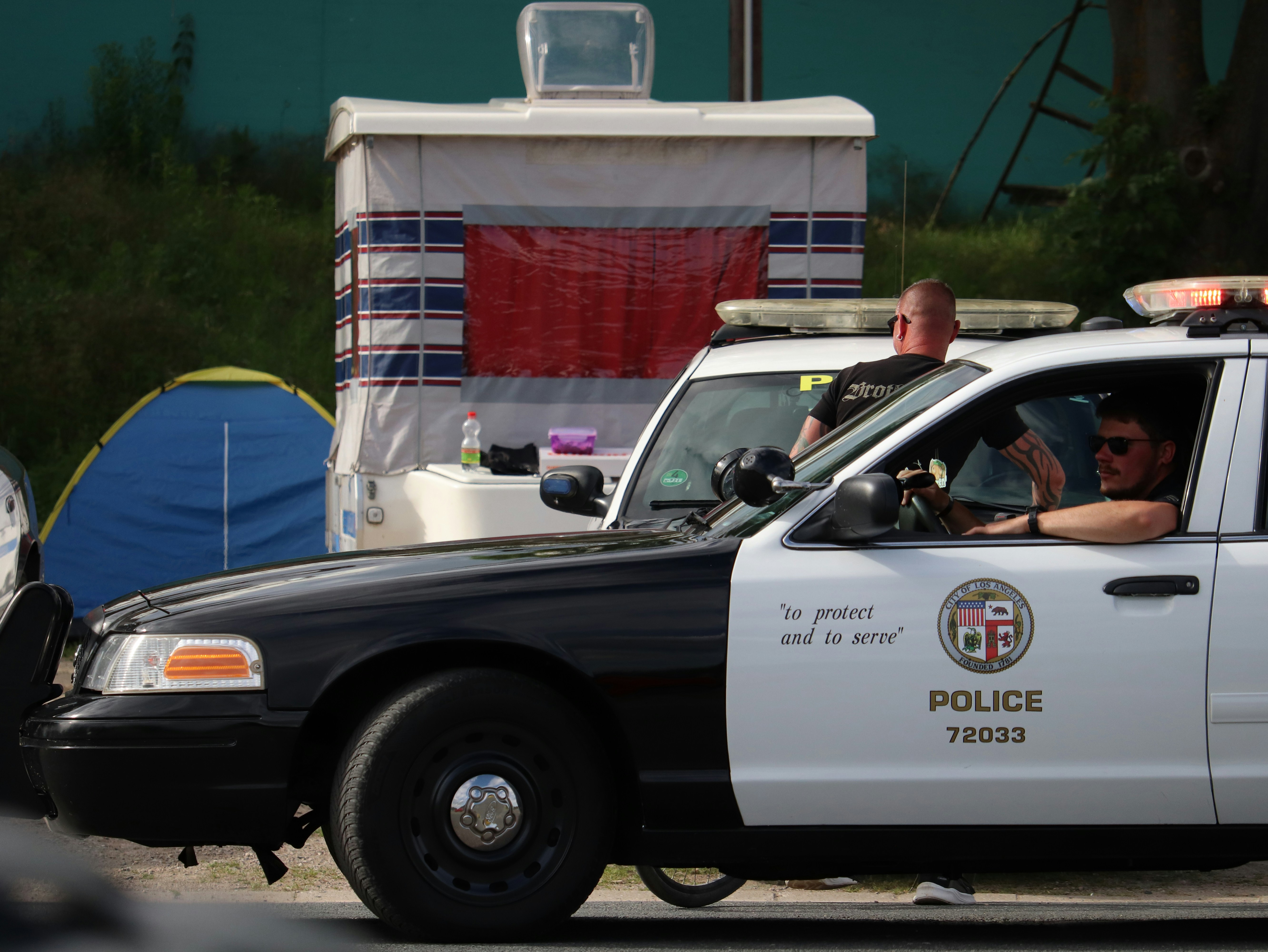 Chase Vehicle: Police Cruiser Resting at a RAID Scene
