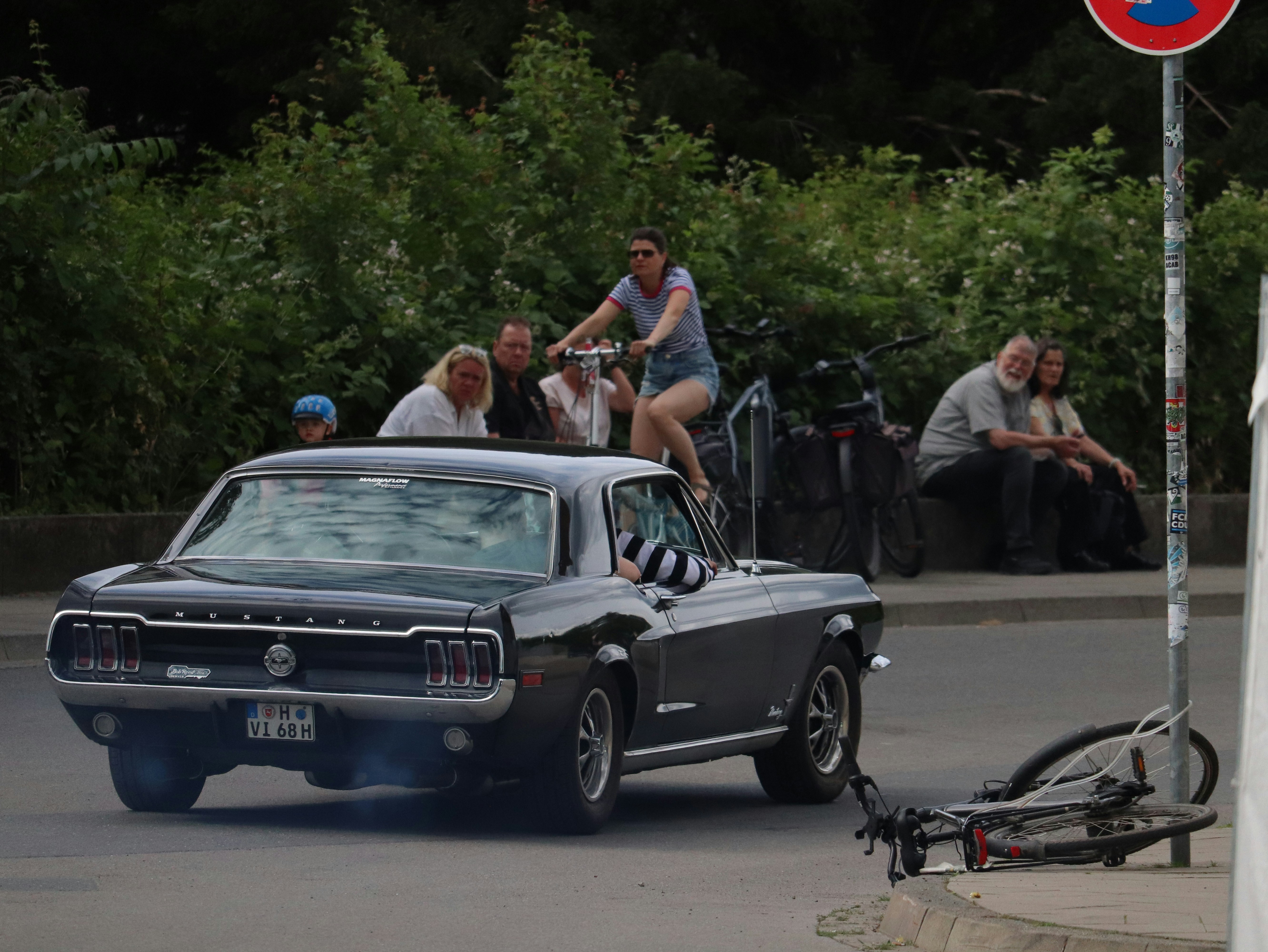 Midnight Torque: A classic Mustang grapples with a roadside bicycle aftermath