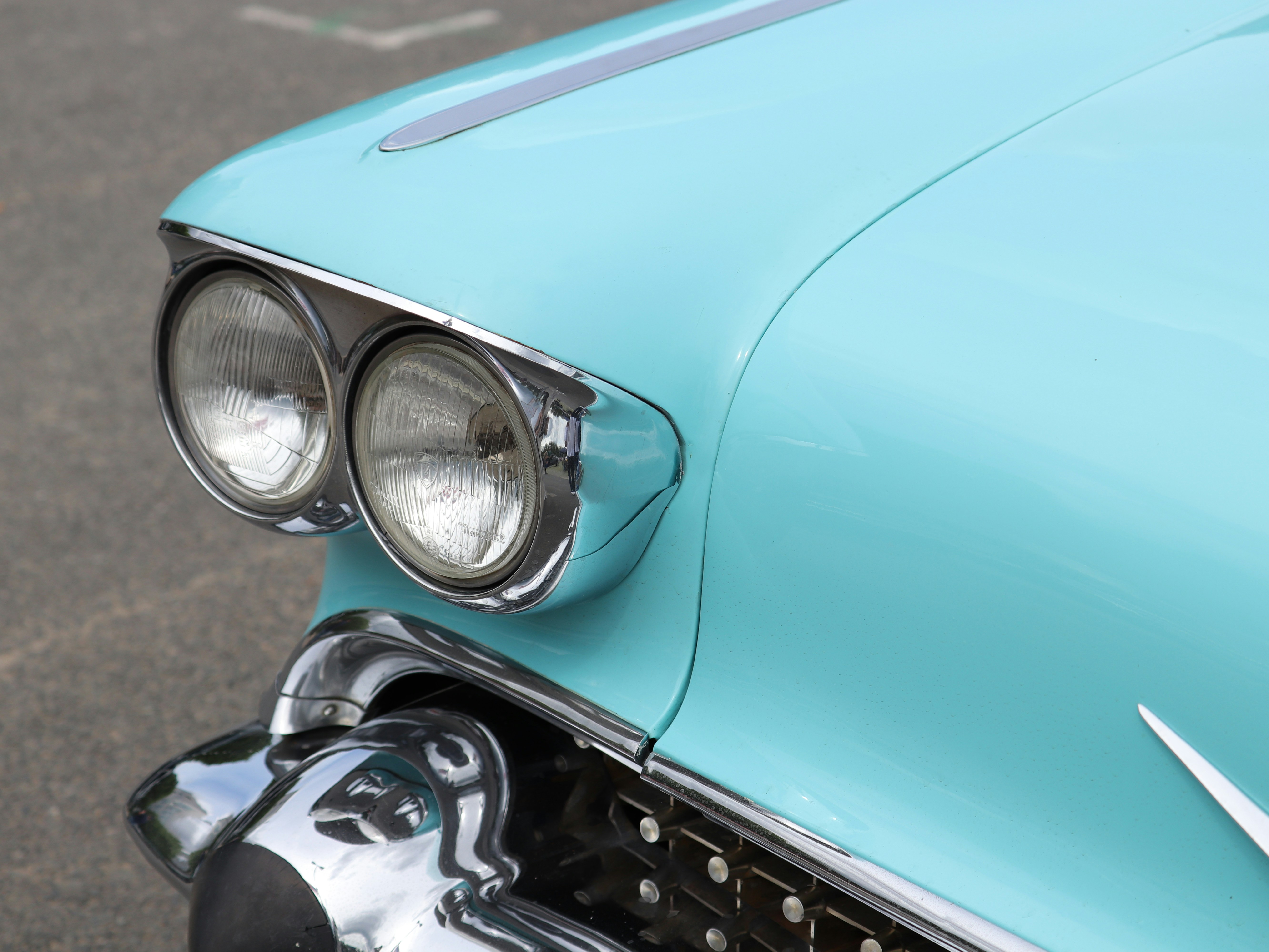 Aqua Chrome: vintage tailfin and twin headlight close-up