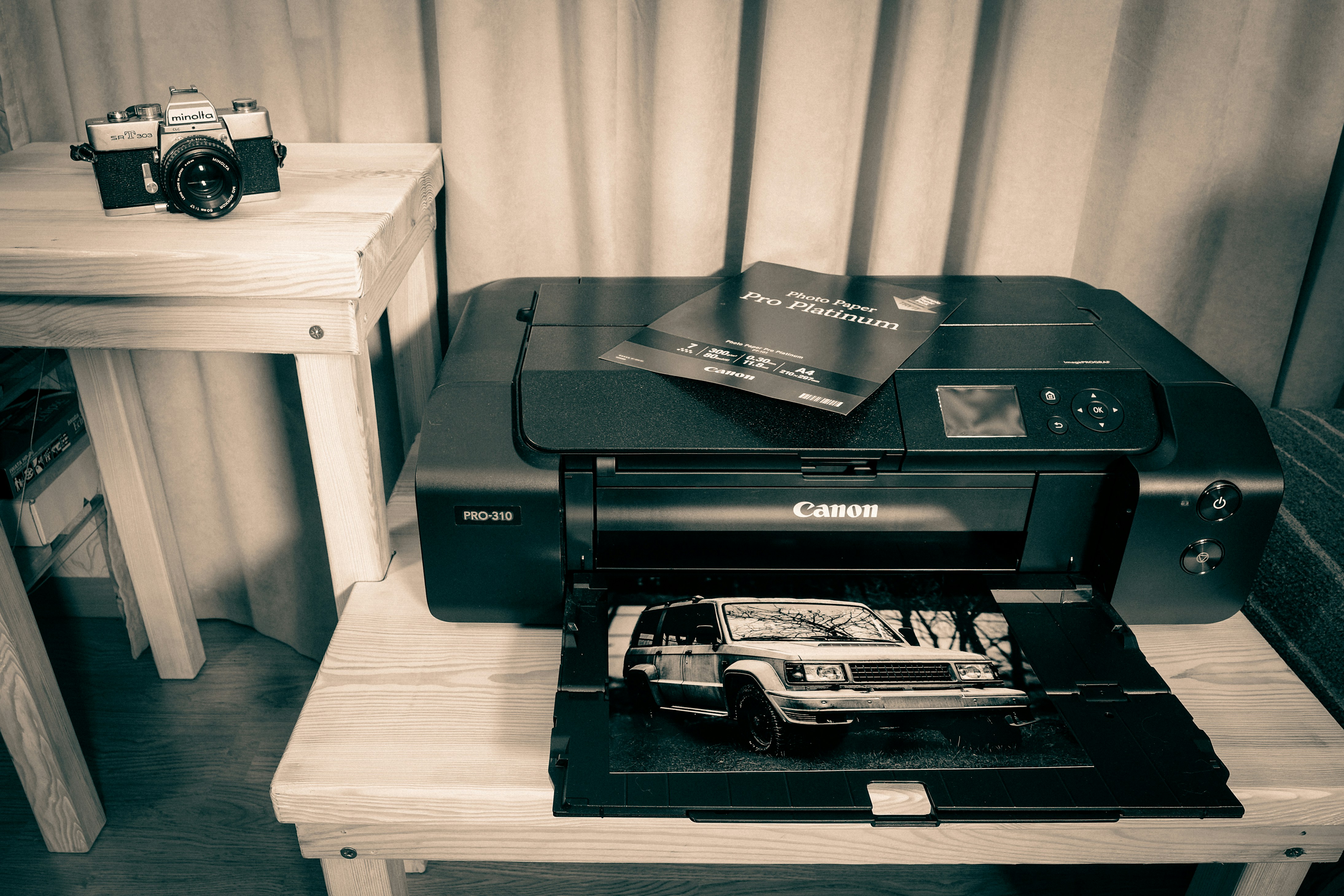 Retro Printer and Vintage Camera Trio on a Wooden Desk