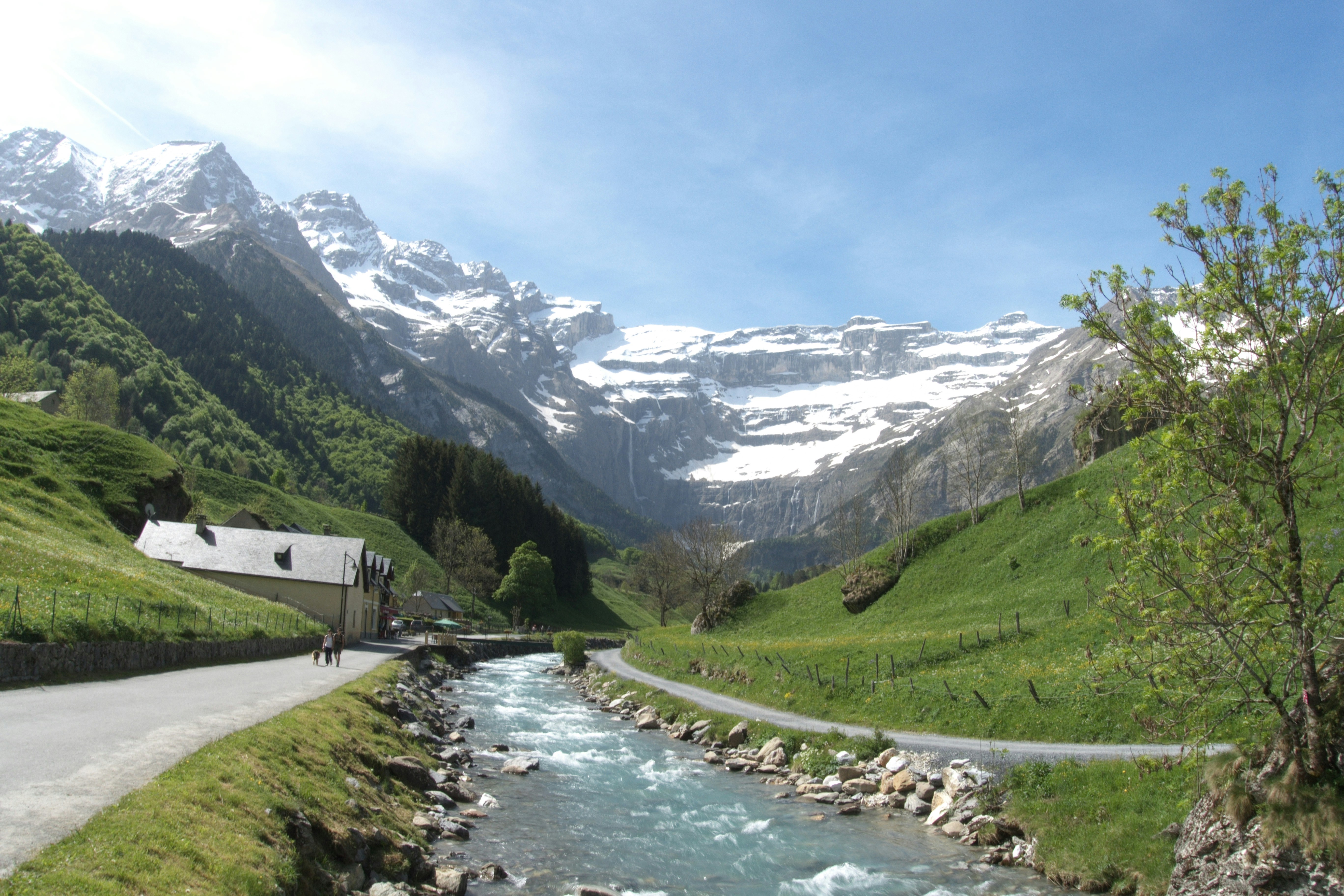 Swift Alpine Brook Under Snowcapped Vistas