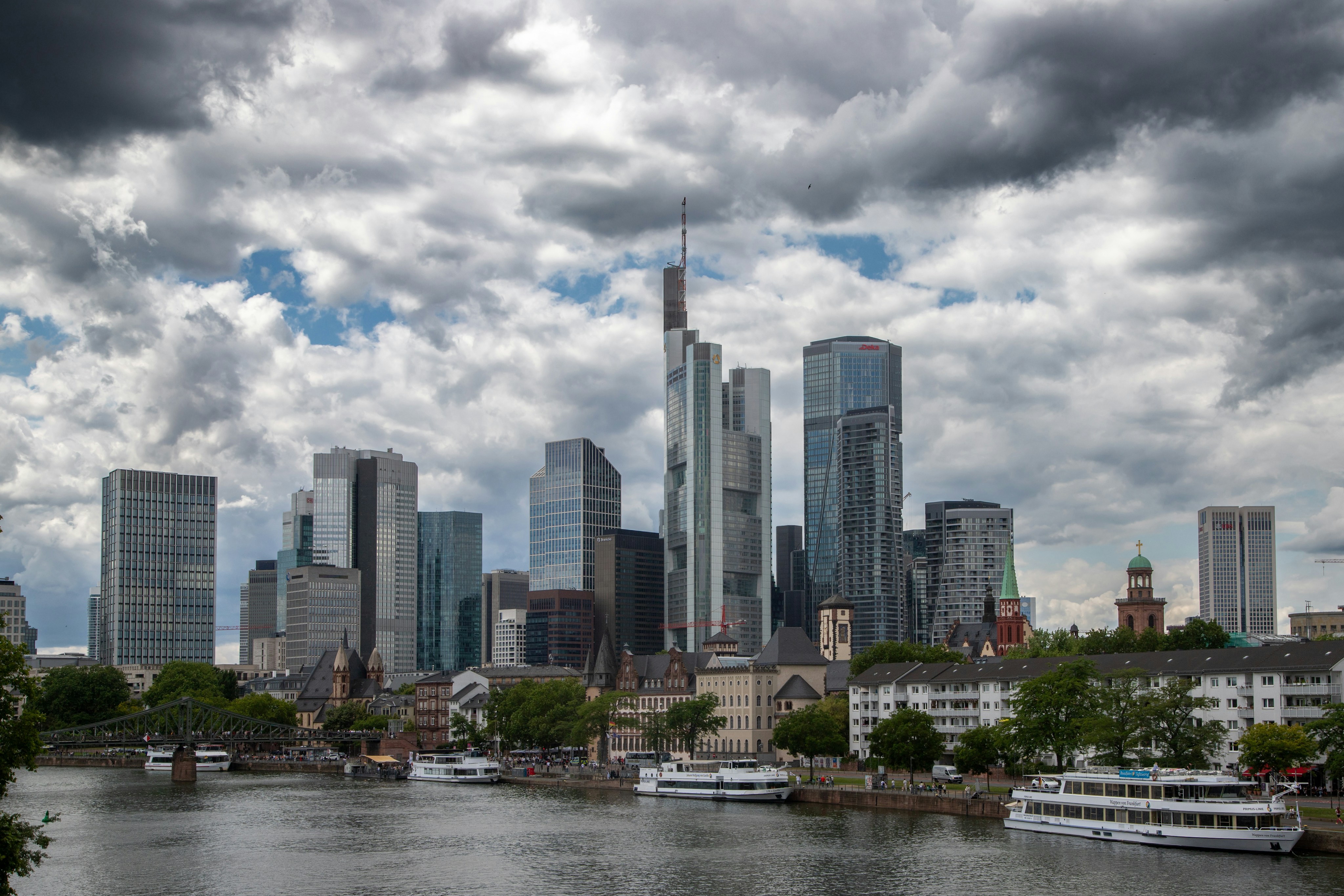 Urban Skyline Over the River: A Cloud-Drawn Morning
