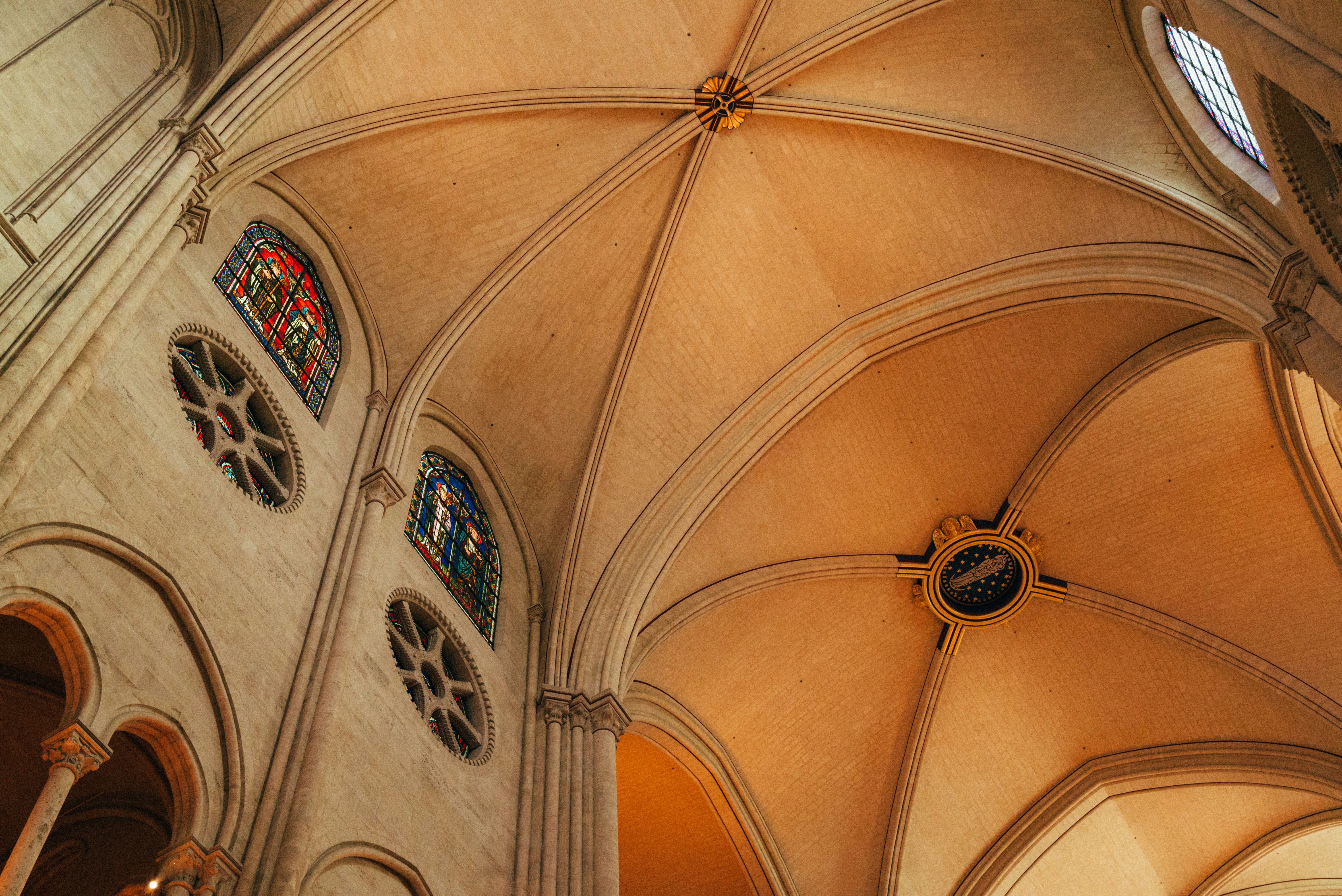 Ceiling Geometry: Vaulted Arches and Tracery in Warm Cathedral Light