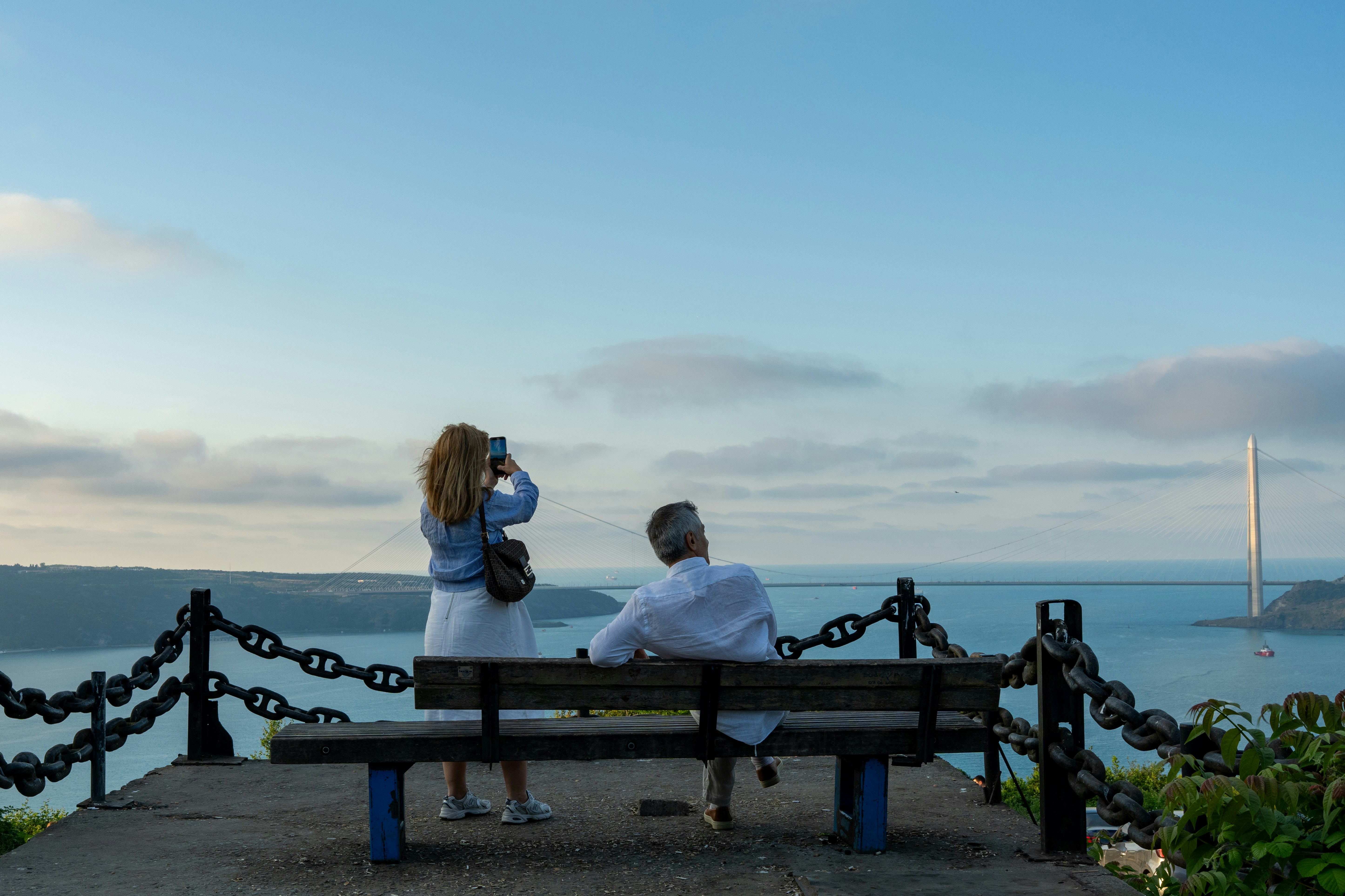 Conversing with the Horizon: A Pair at the Cliffside Vista