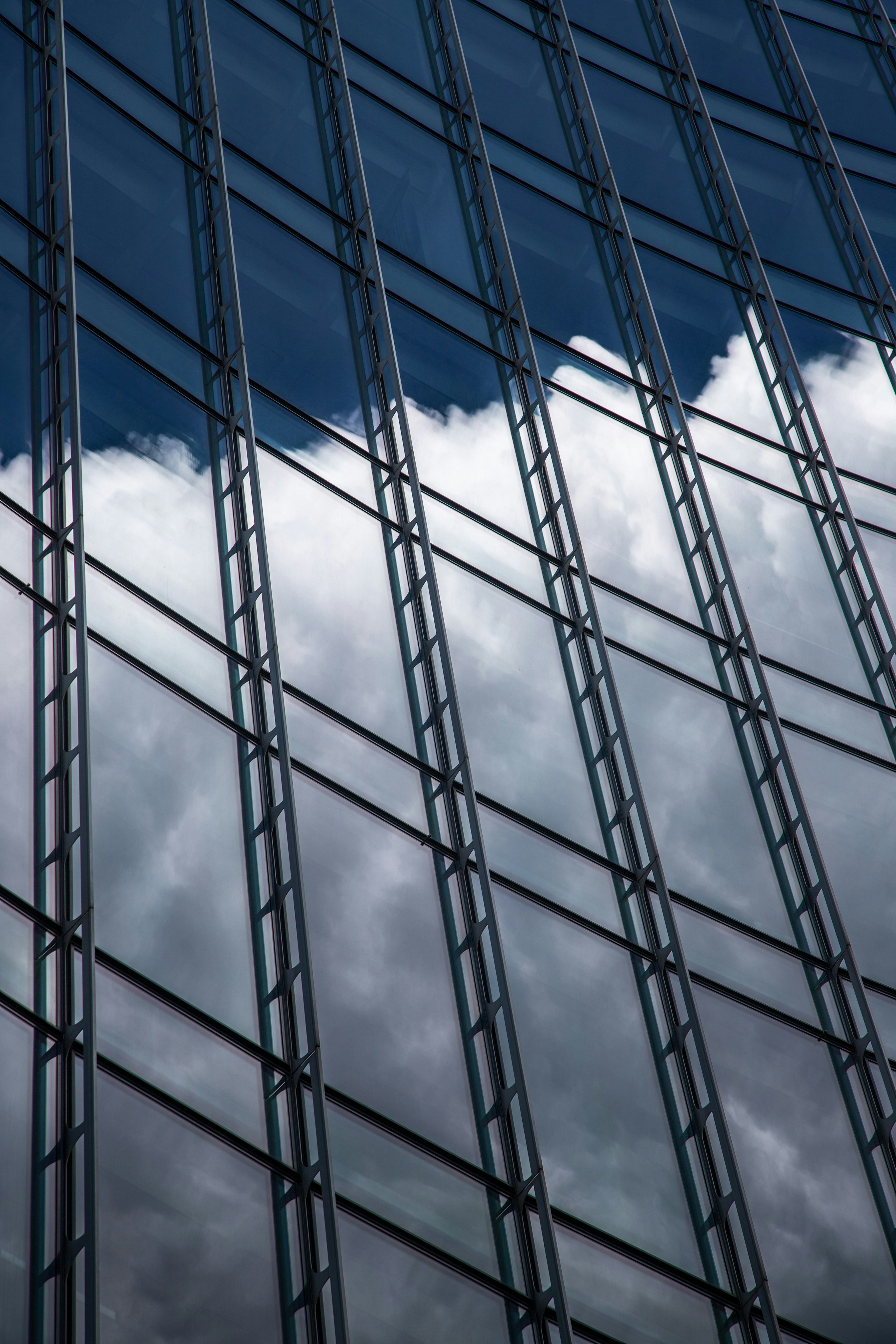 Reflections in Steel: Vertical Grid of a Modern Glass Facade