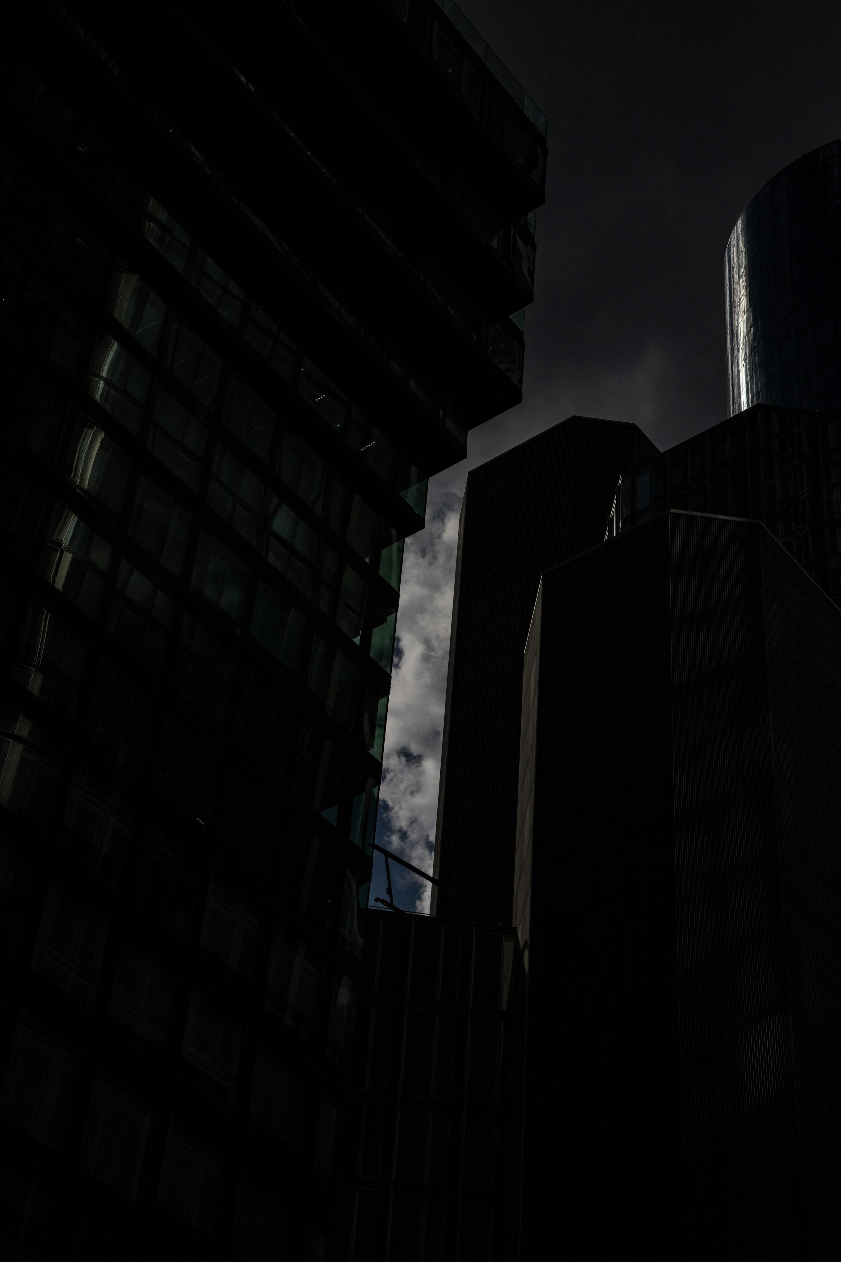 Between Glass and Sky: A Midnight Shard of City Towers