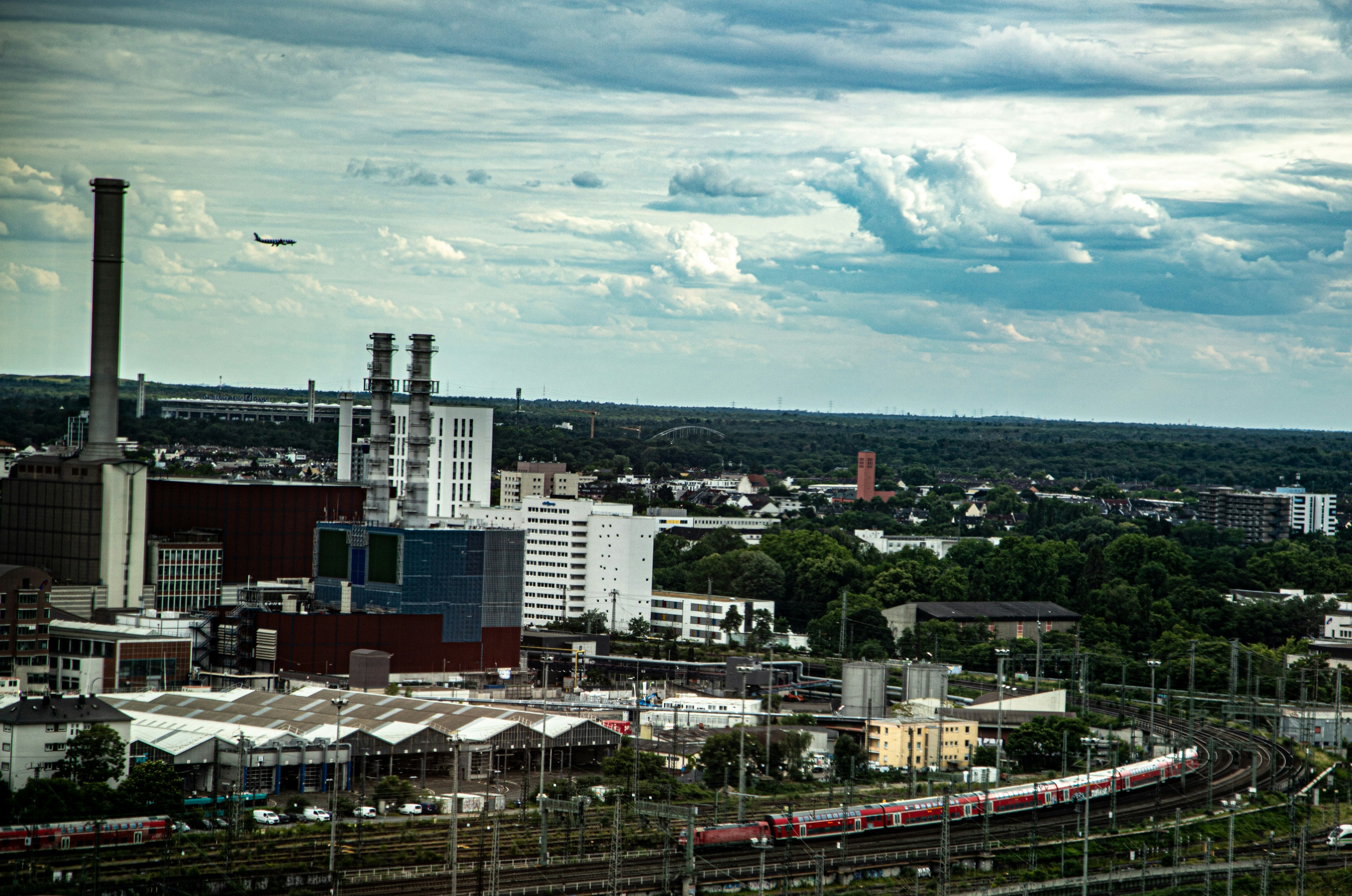 Green City Rail: Aerial View Over a Modern Industrial Skyline