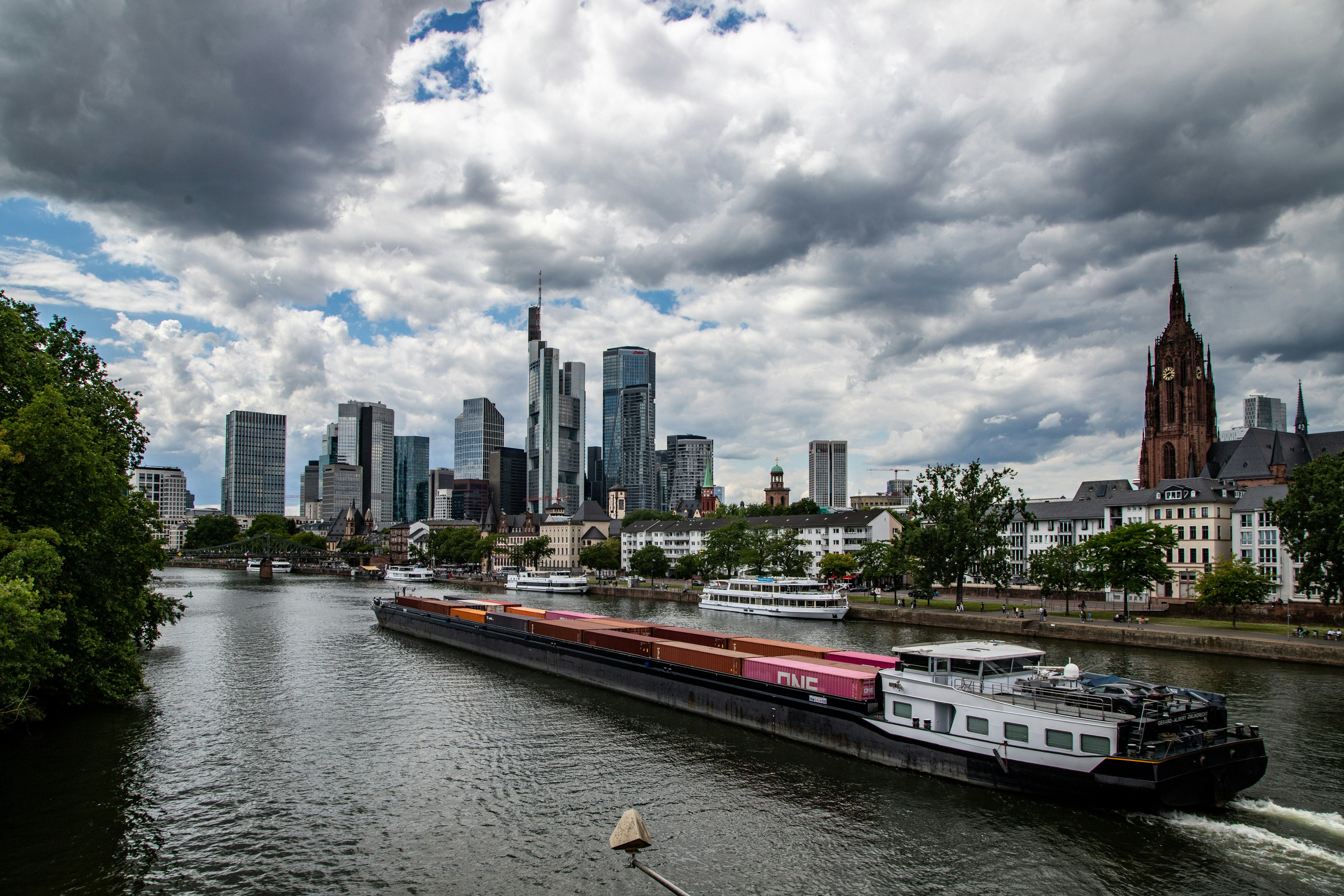 Towboats at the Riverfront: A City Skyline Under Open Skies