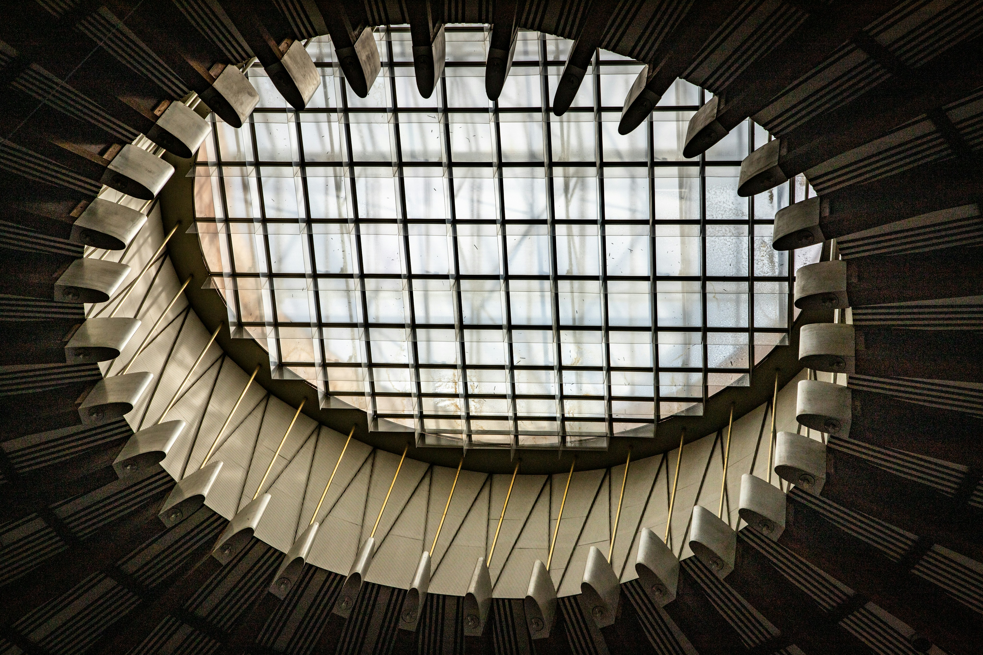 Oculus of Steel and Glass: A Spiral Skylight’s Geometric Echo