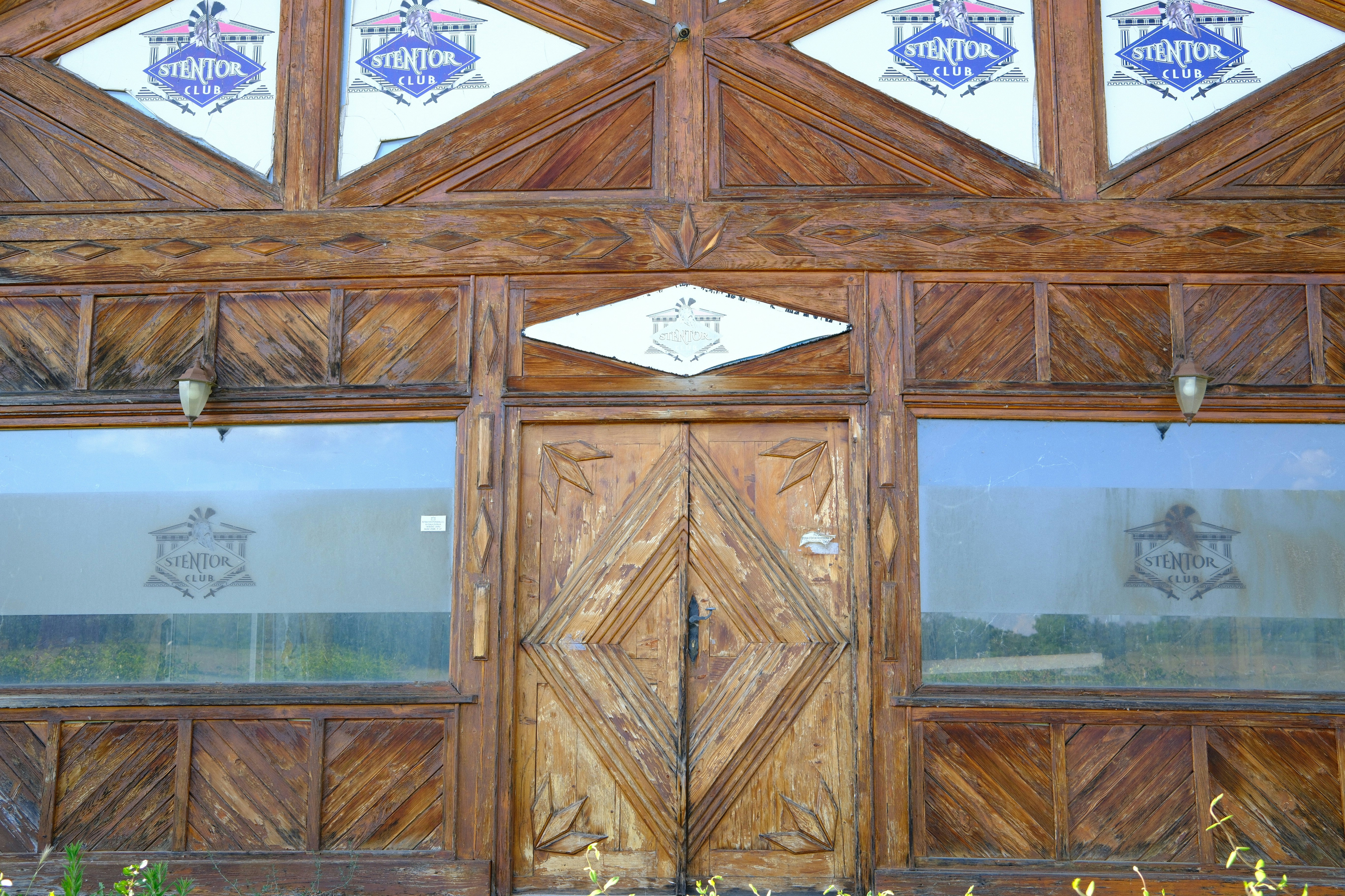 Weathered Cedar Gate: Symmetry and Time in Carved Wood