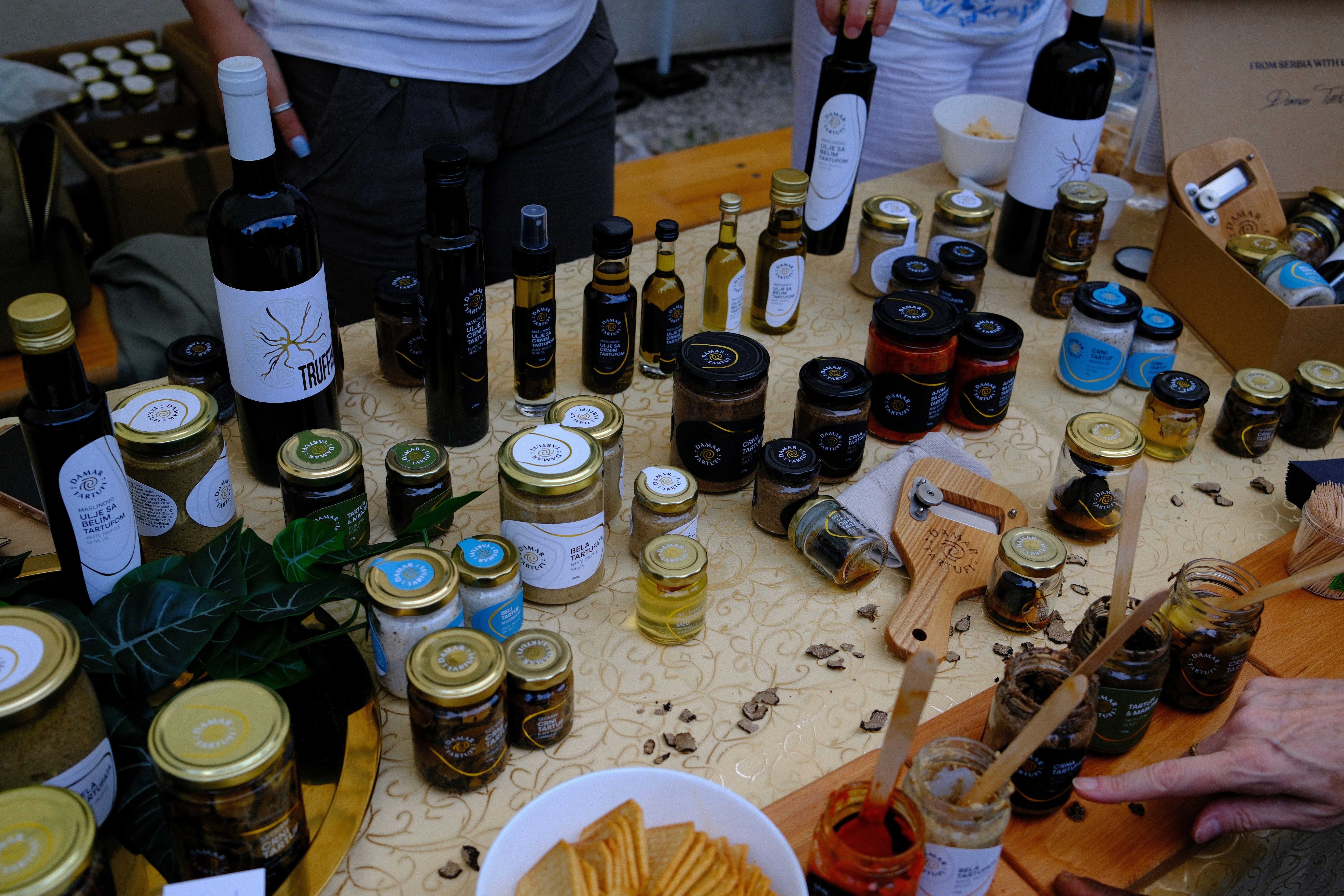 Rustic Market Table of Jars: A Colorful Spread of Oils and Preserves