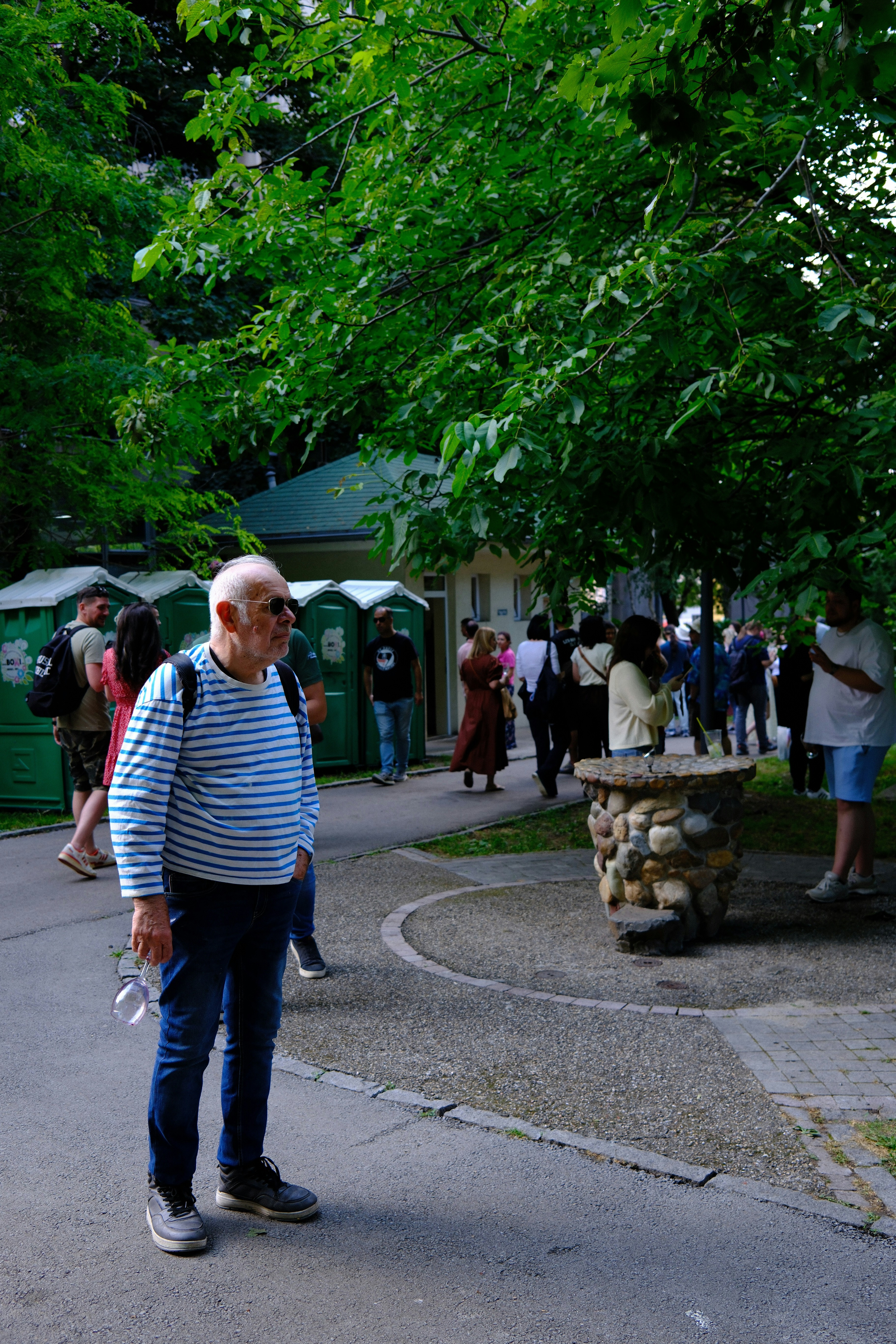 Stranger in the Park: A Striped Stranger in a Busy Square