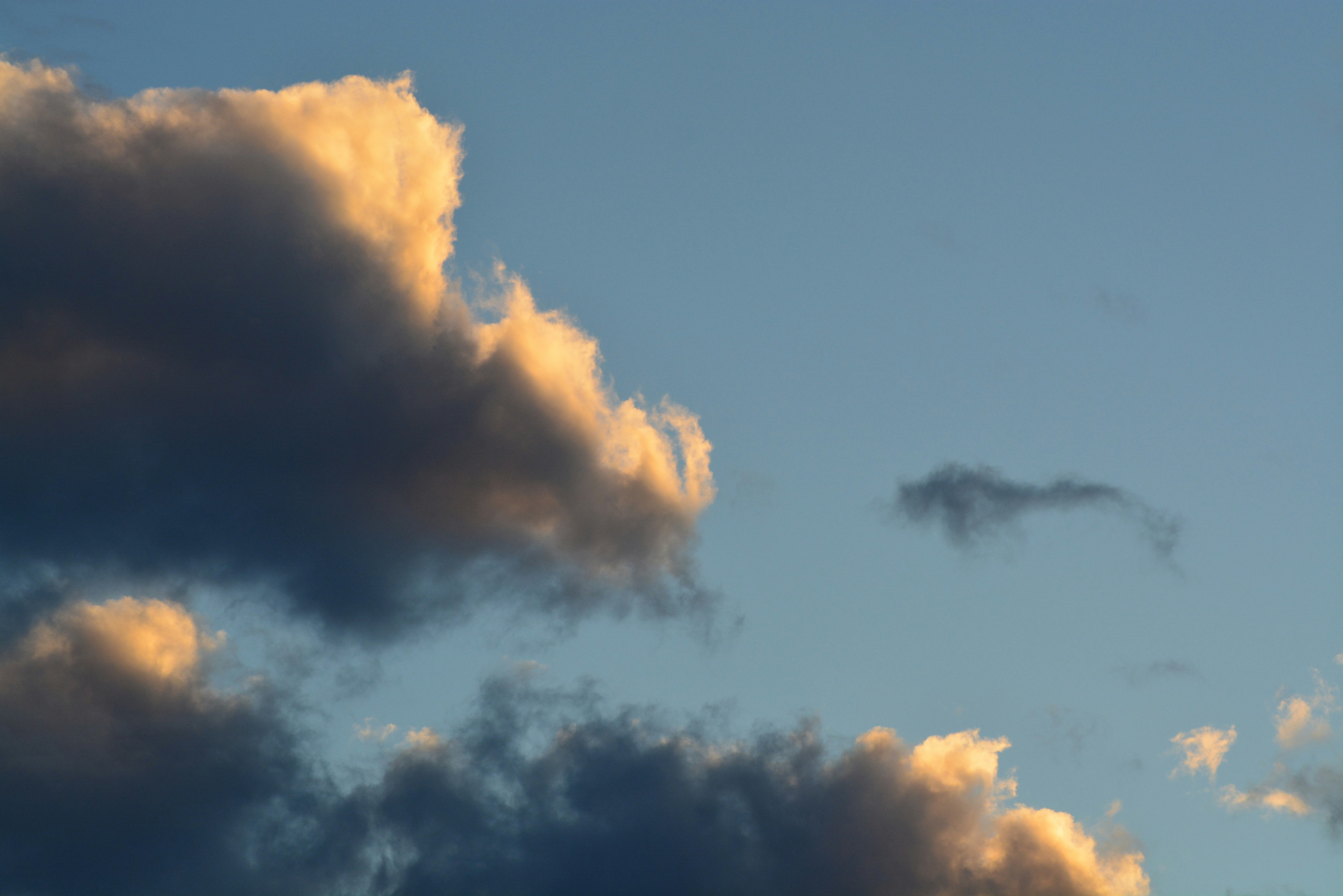 Golden-Capped Cloud Edge Over Quiet Blue Sky