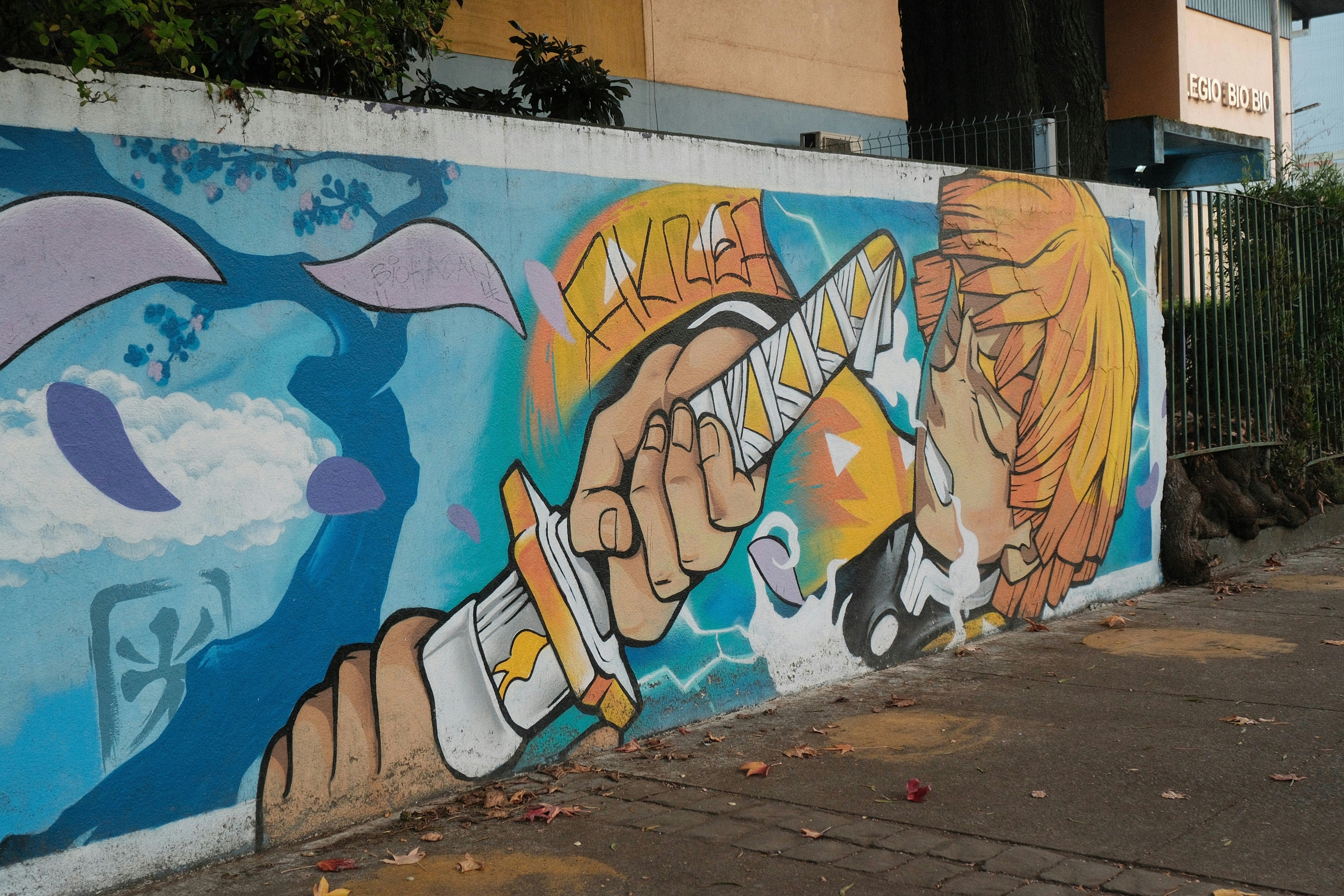 Vibrant mural of an anime character with a sword.