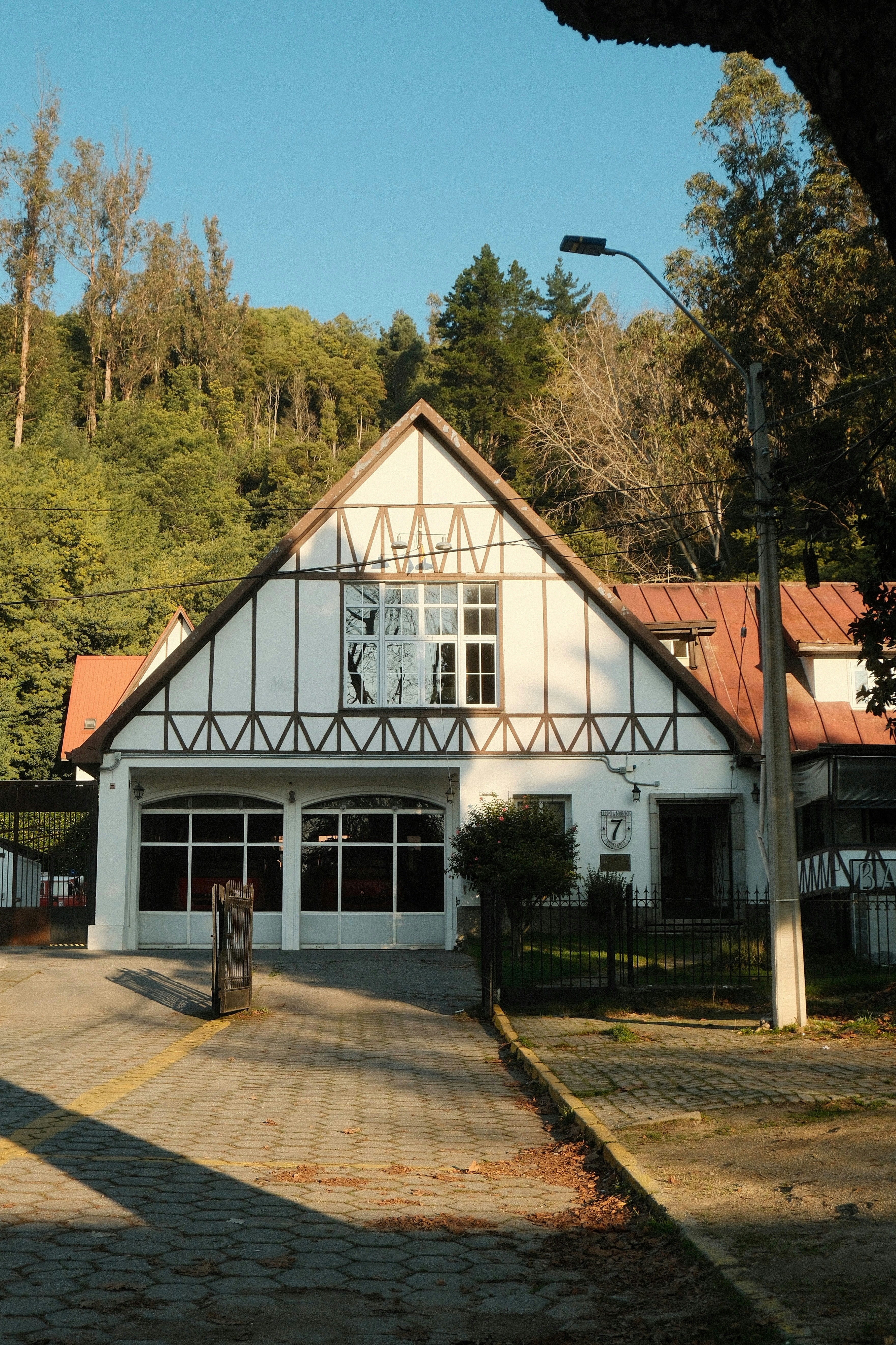 timber-framed storefront under a sunlit gable