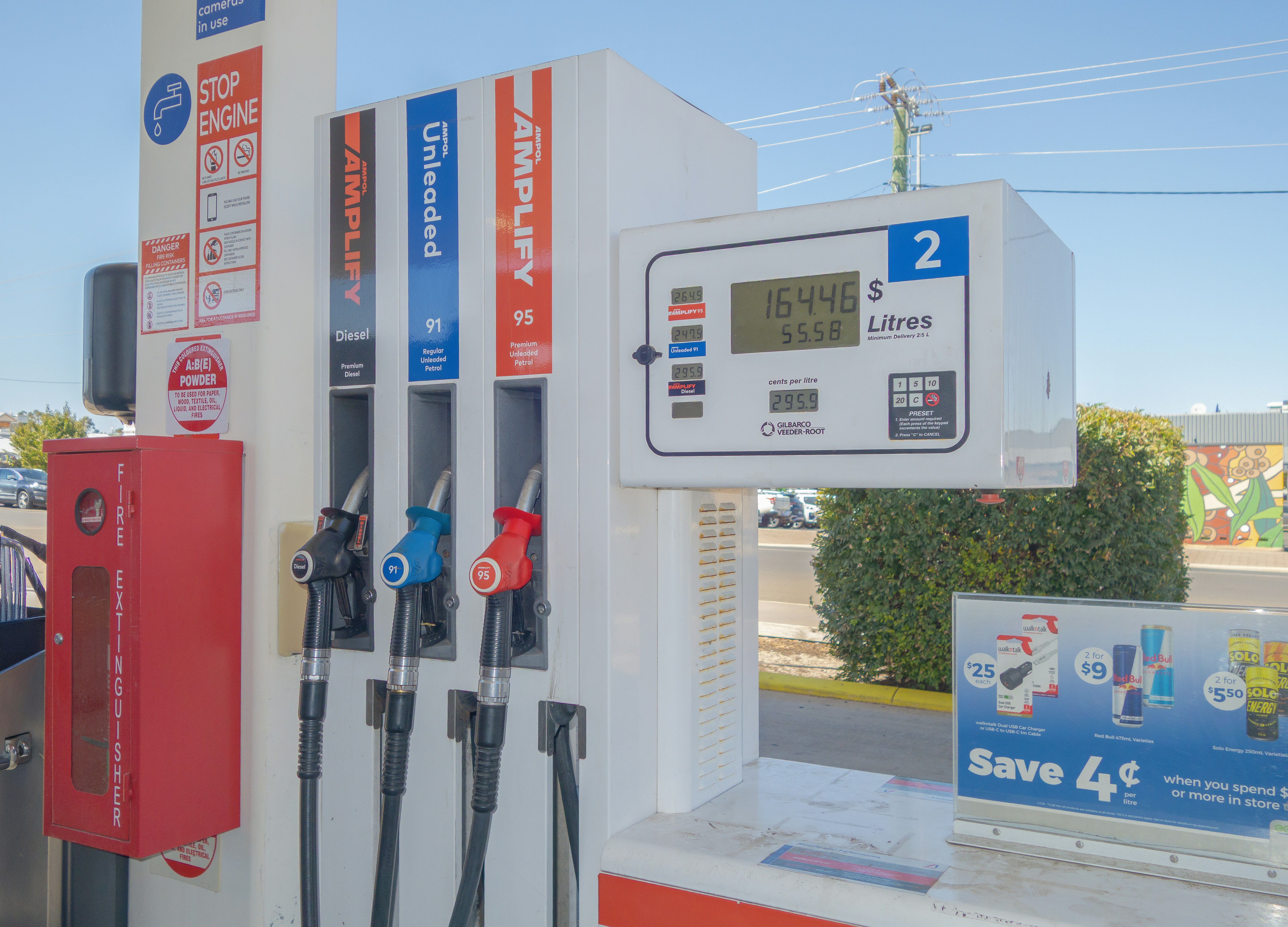 A gas pump with multiple nozzles and a digital display.