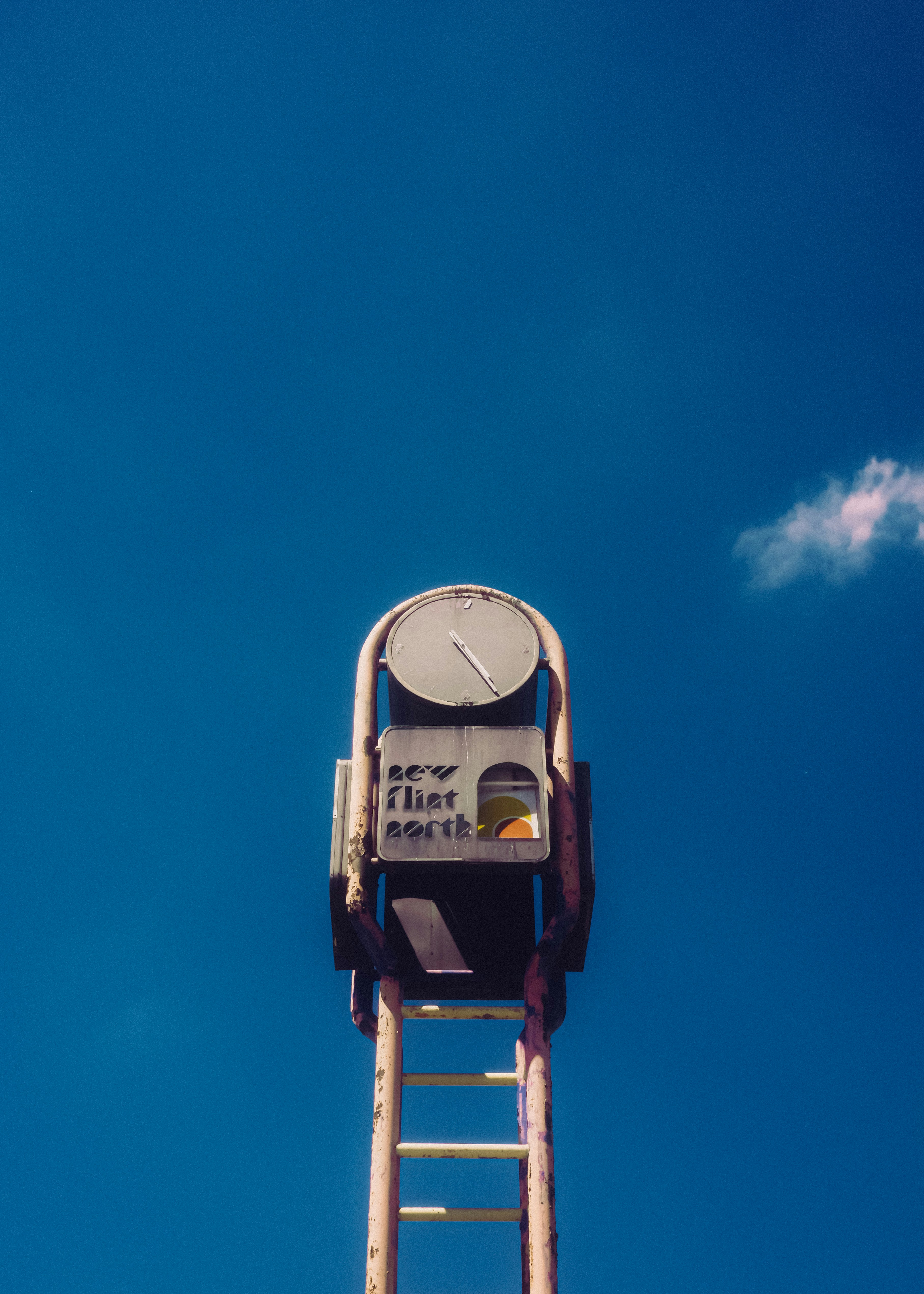 Upward Look: A Weathered Signal Light Reaching Toward the Sky