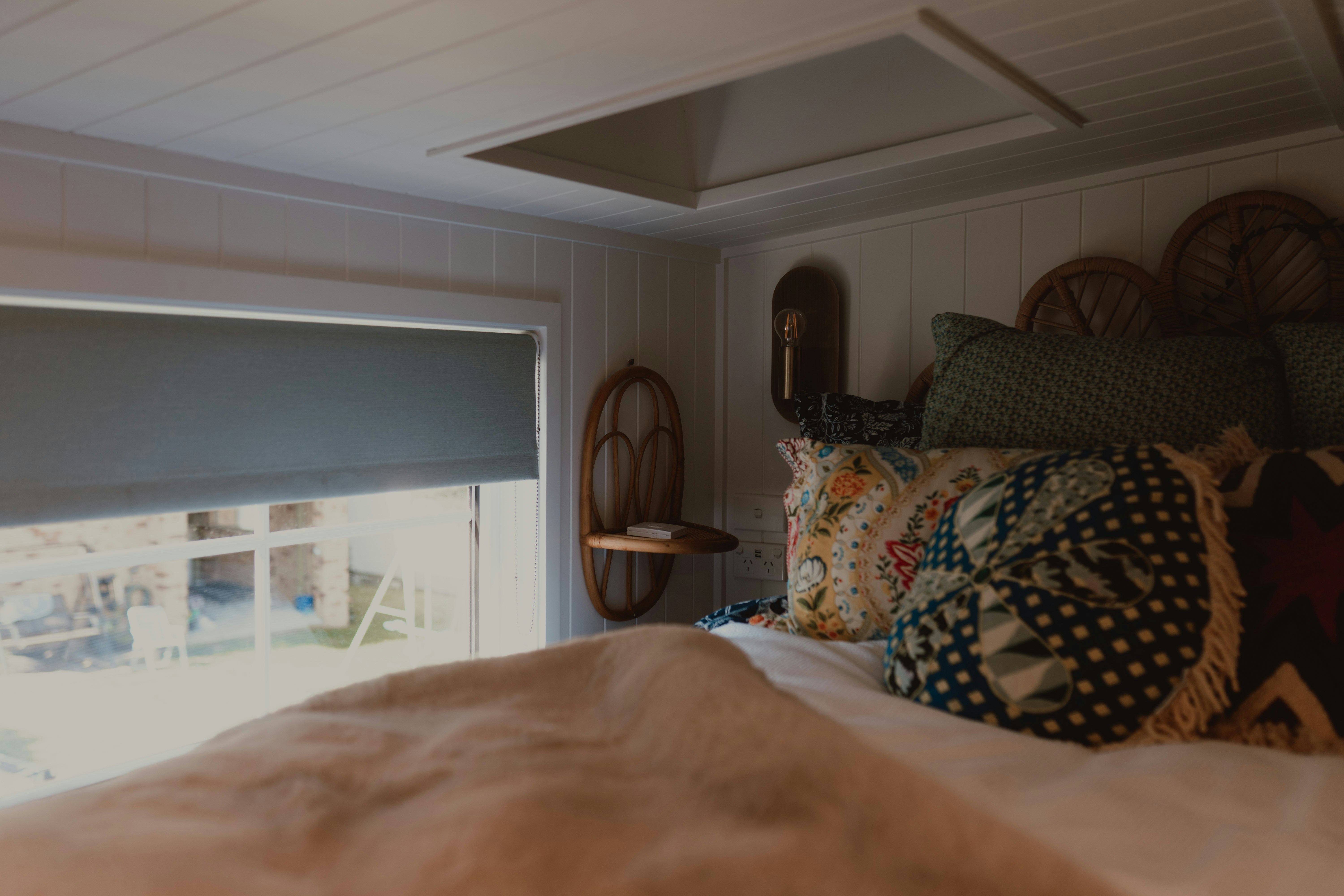 Cozy Bed Scene Under Dormer Light