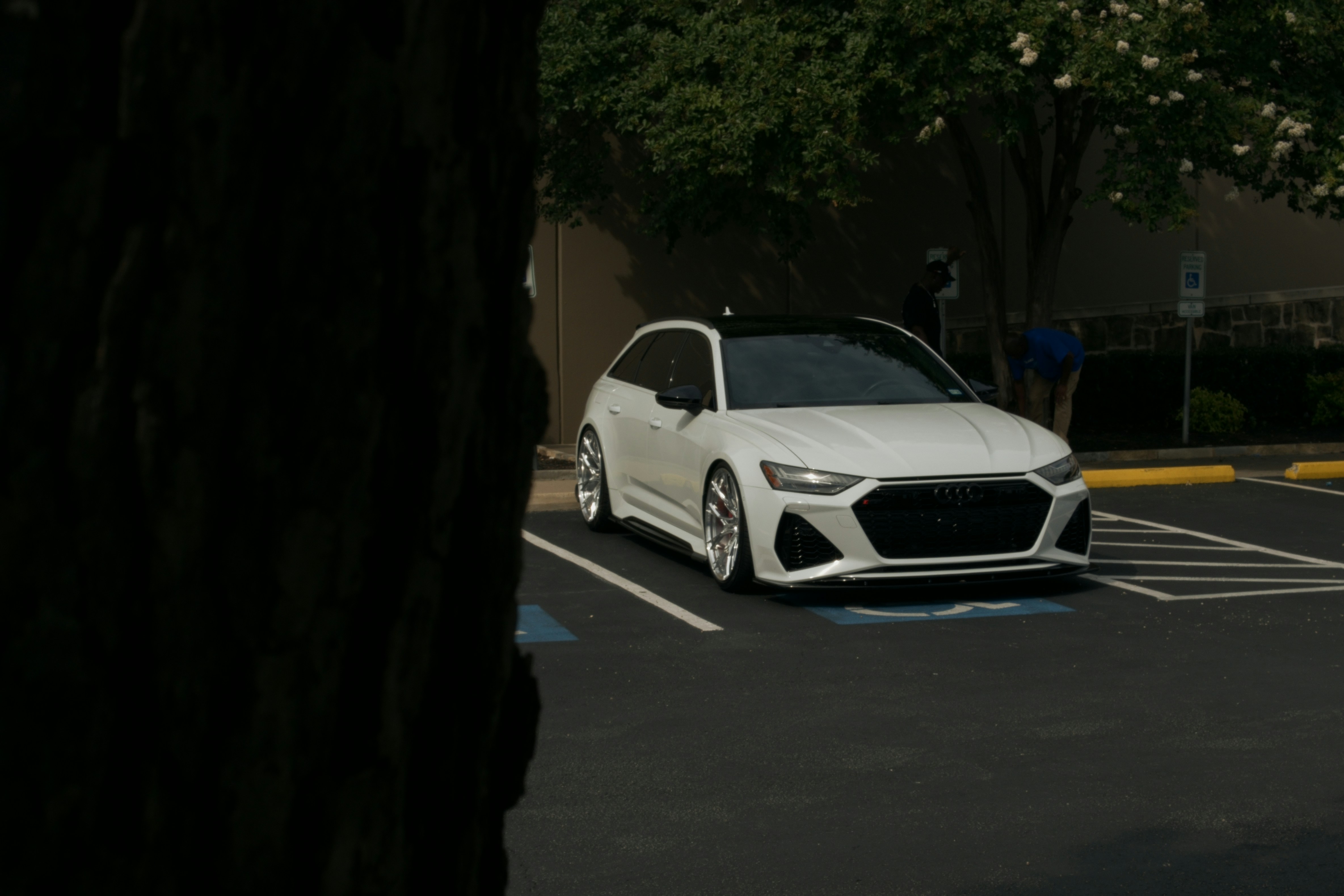 White Performance Hatch Emerges from Shaded Parking