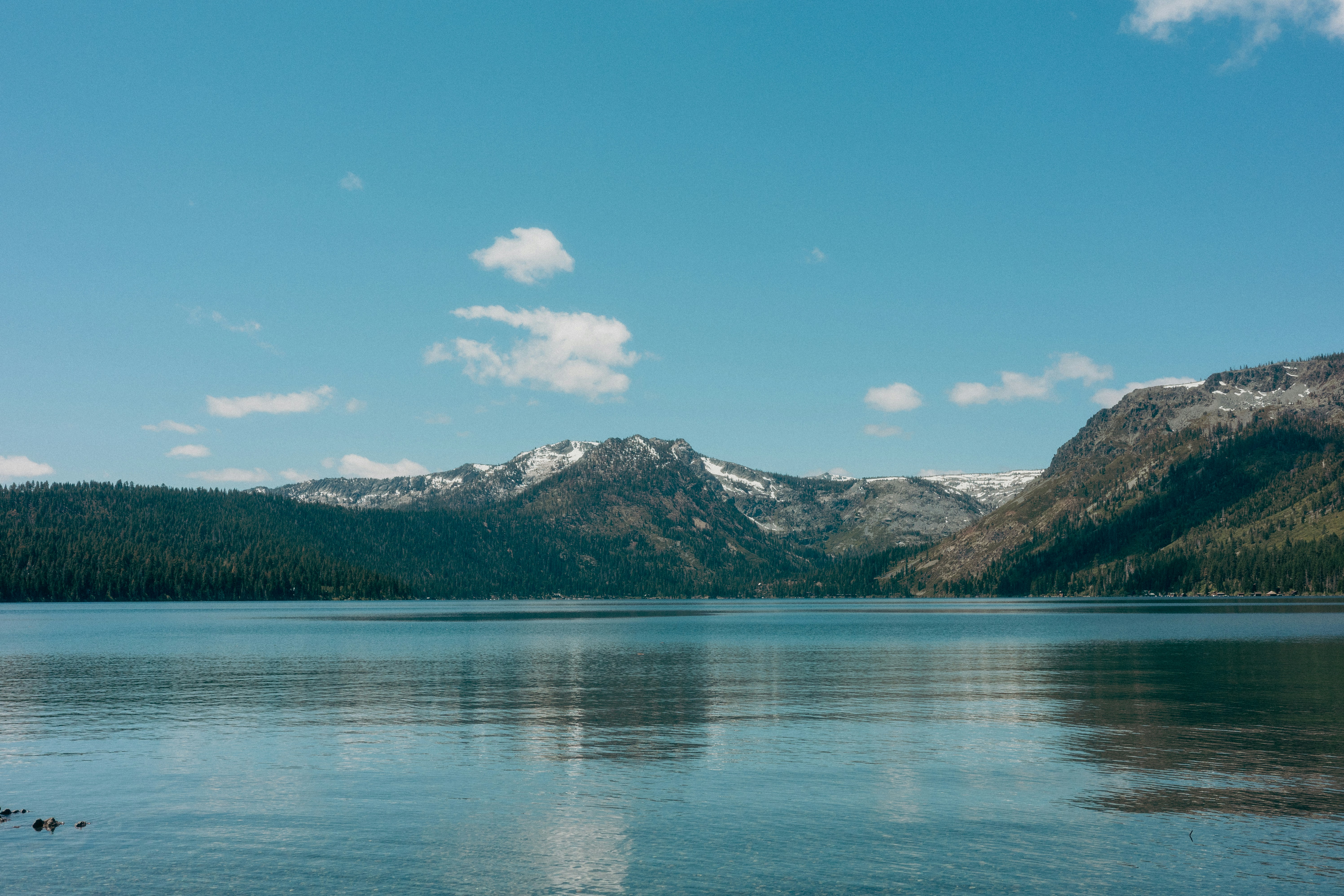 Mirror of Mountains: A Quiet Lake Under a Vast Sky