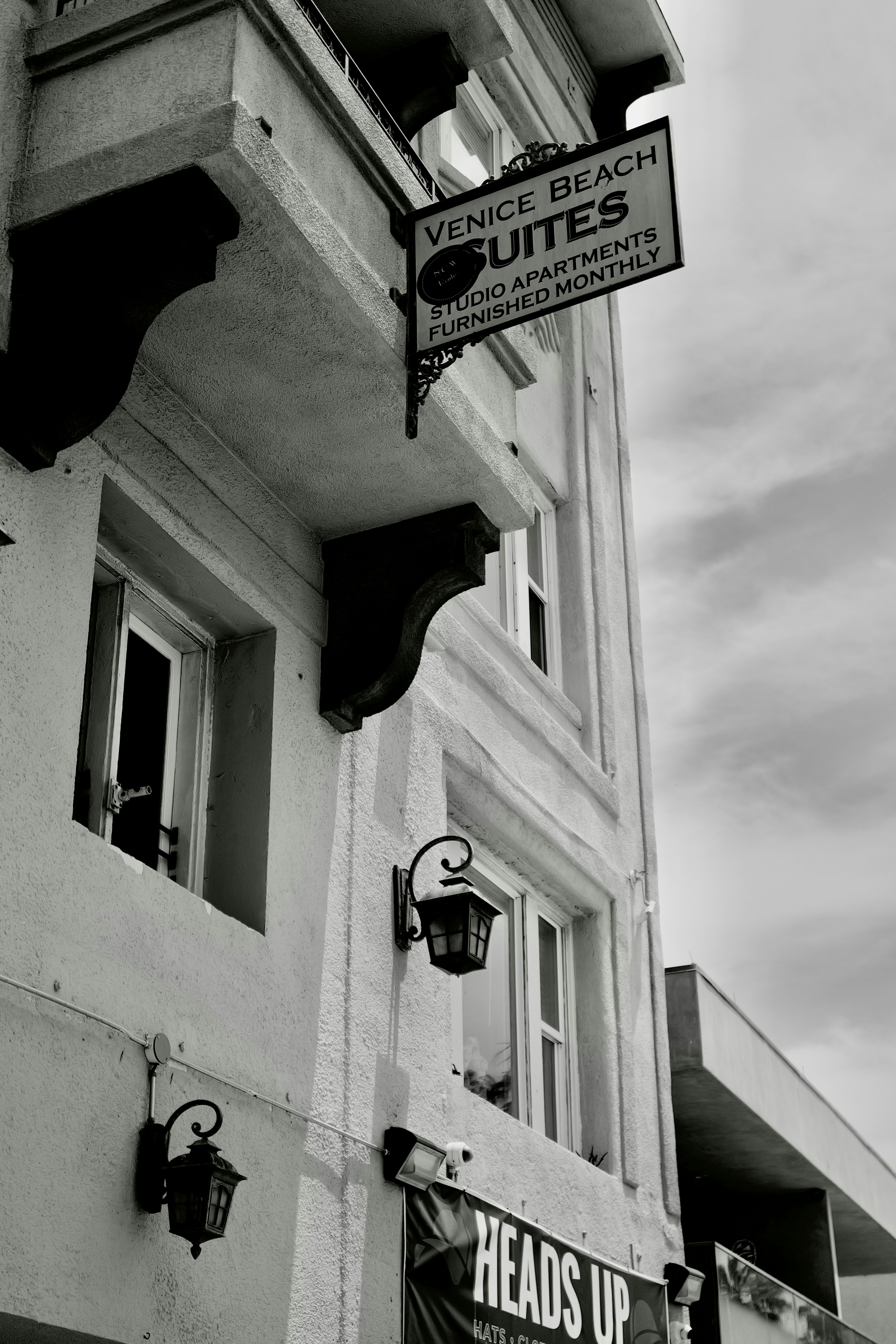 Facade Signage and Lanterns: A Monochrome Street Portrait