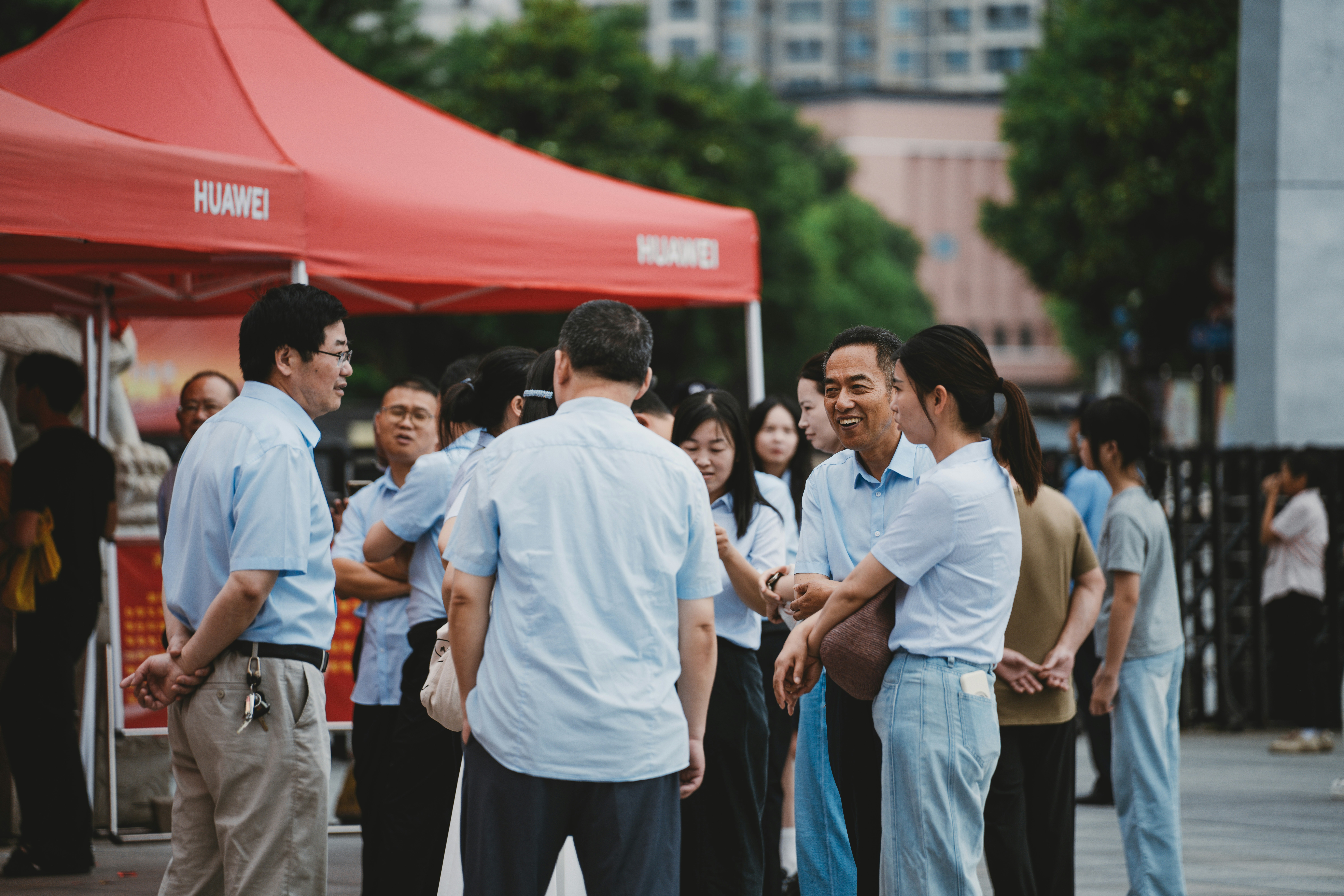 Handshake under the Red Canopy: a moment of equal voices at the tech expo