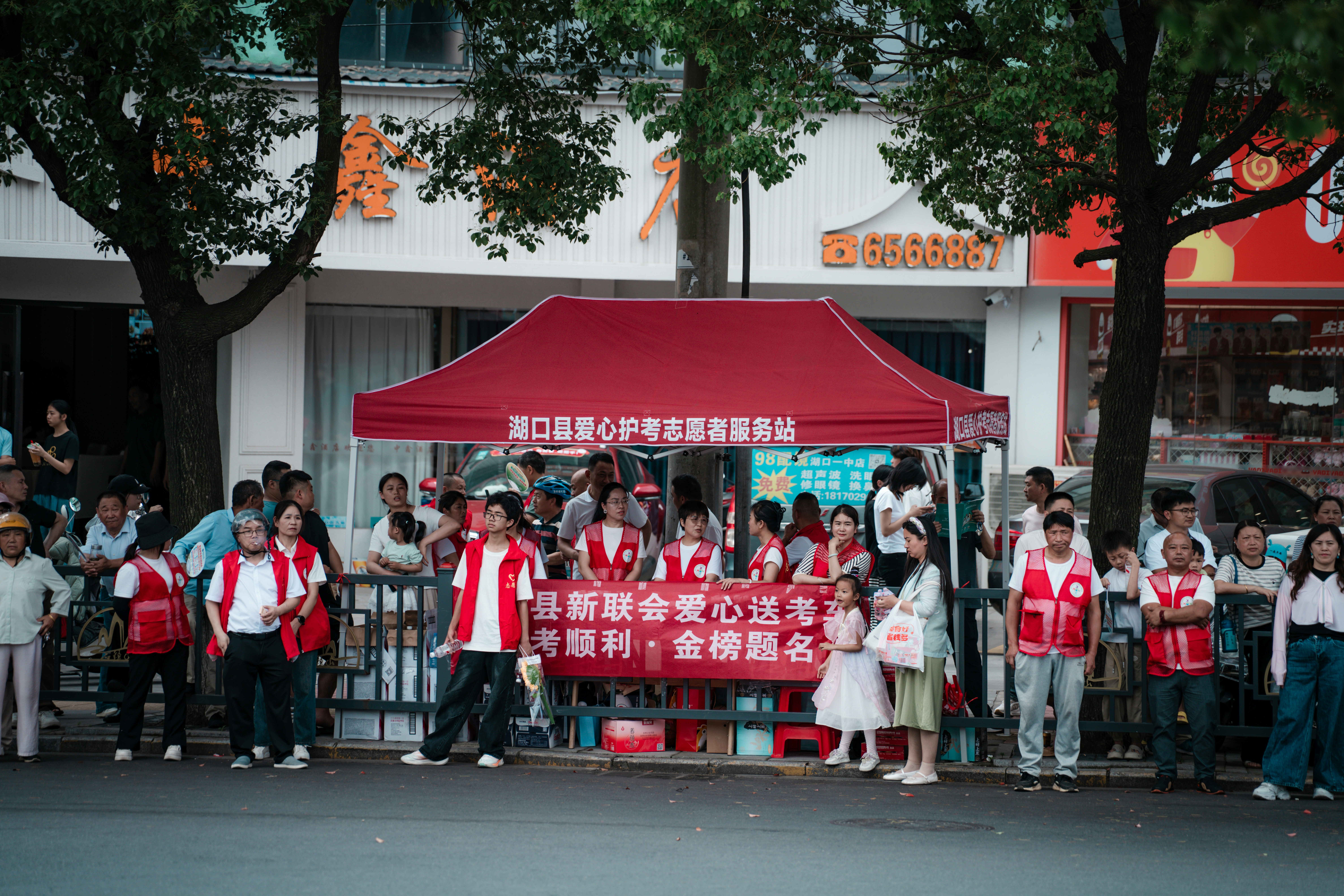 Red Tent Rally: Community Banner Under the Streetfront