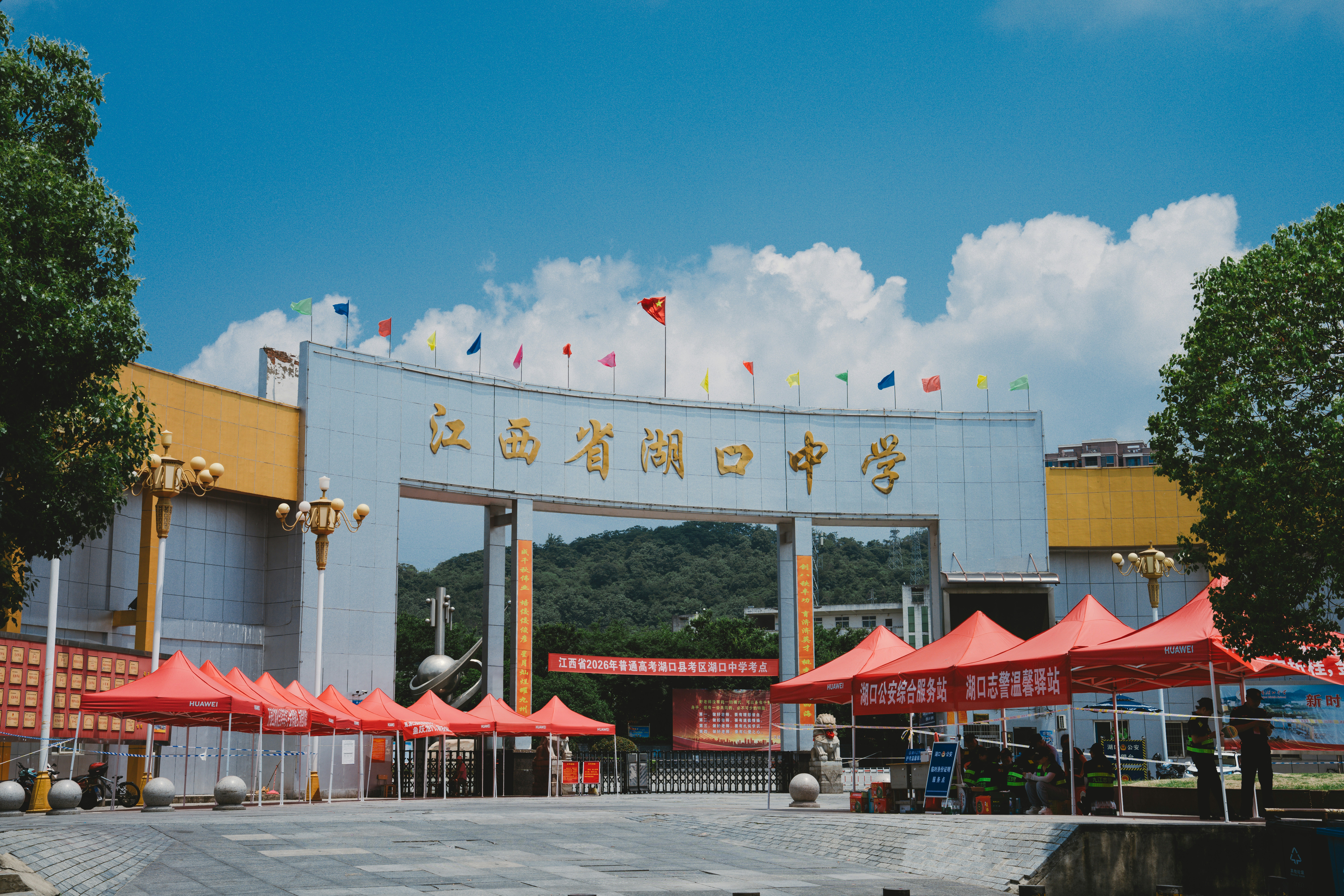 Gate of Learning: Colorful Flags Over a School Entrance