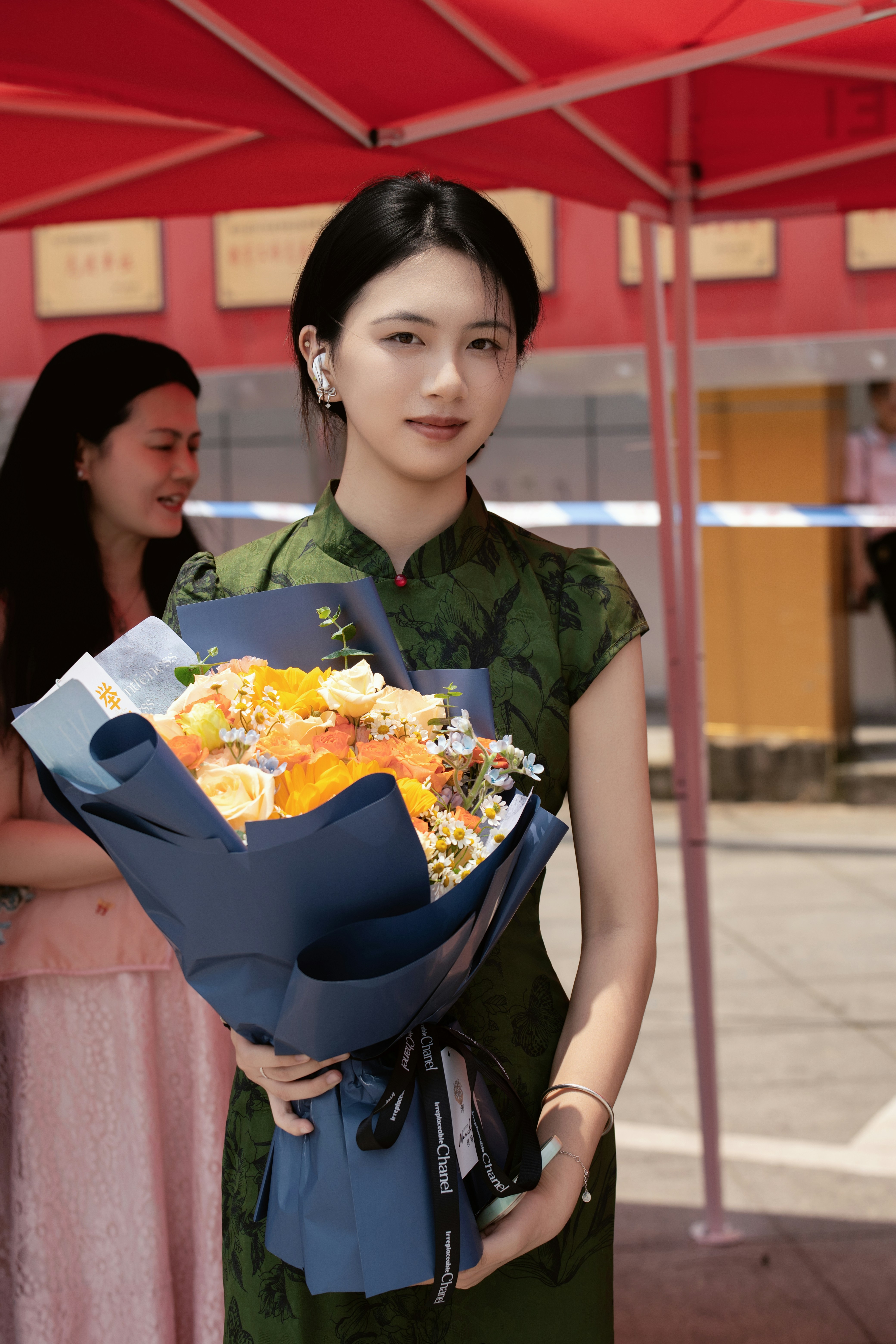 Bouquet and Portrait under a Red Canopy