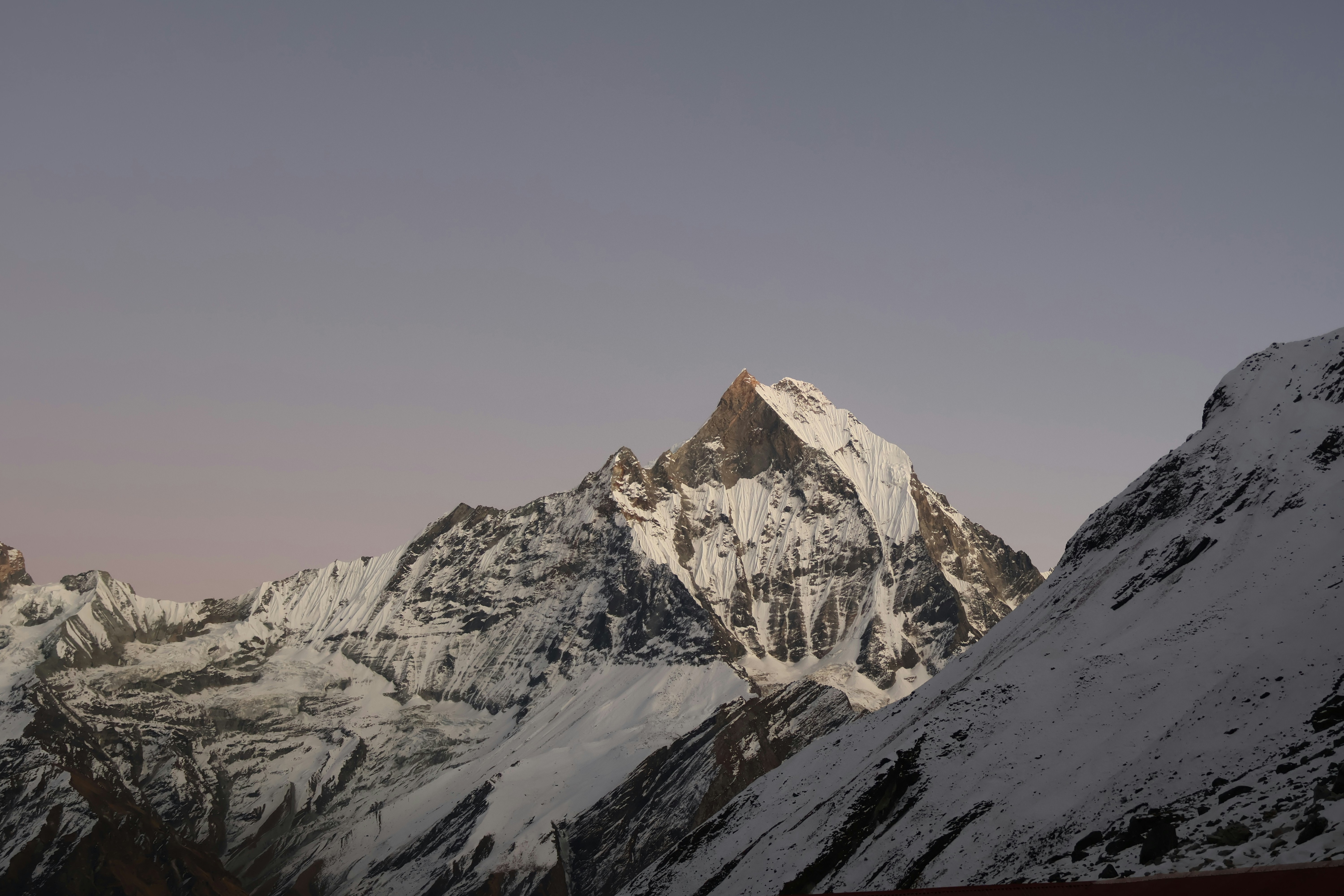 Twin Peaks at Dusk: The Central Summit Emerges Over Snow-Bound Ridges