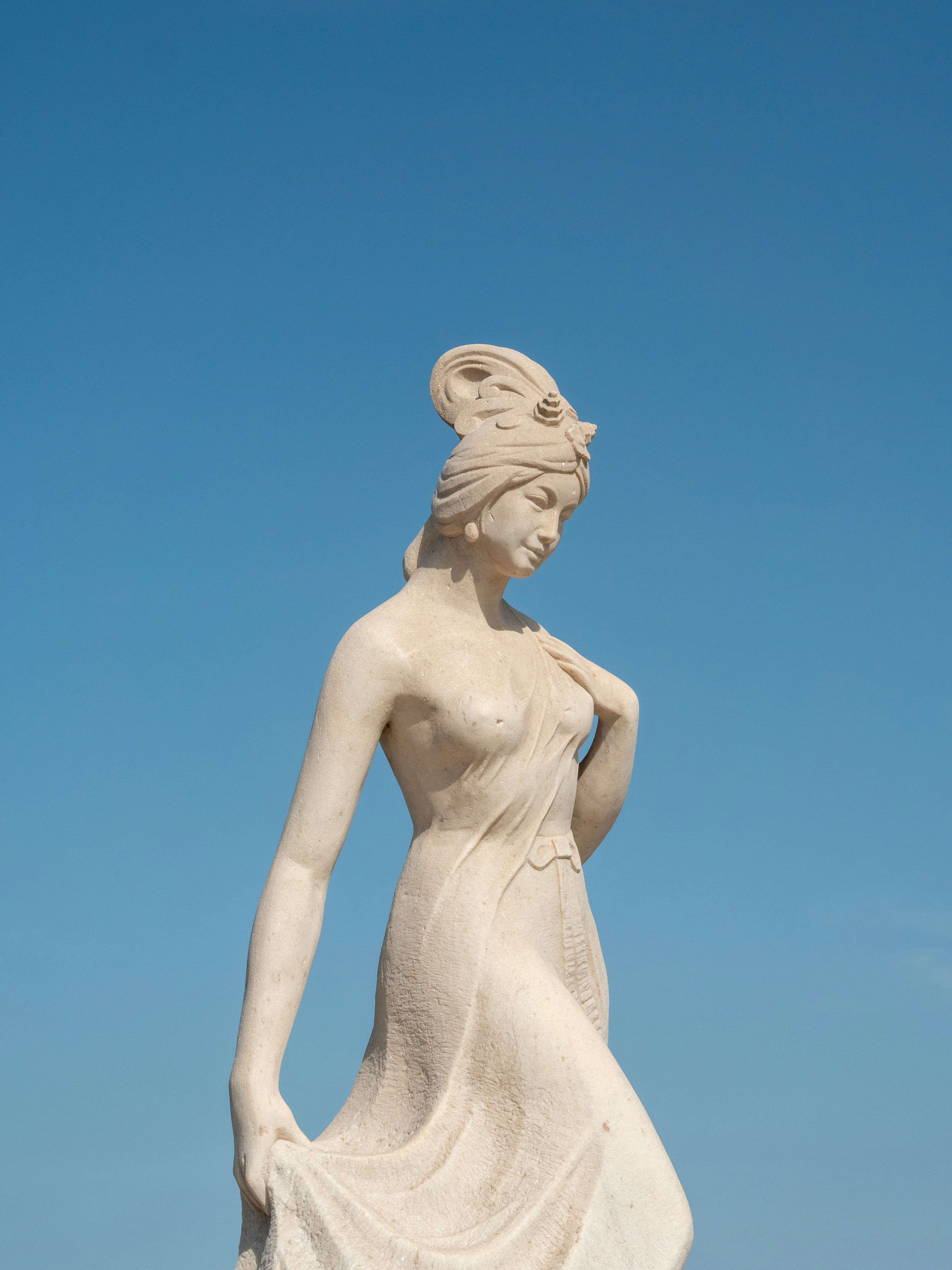 Grace in Stone: A Sentinel Under a Clear Blue Sky