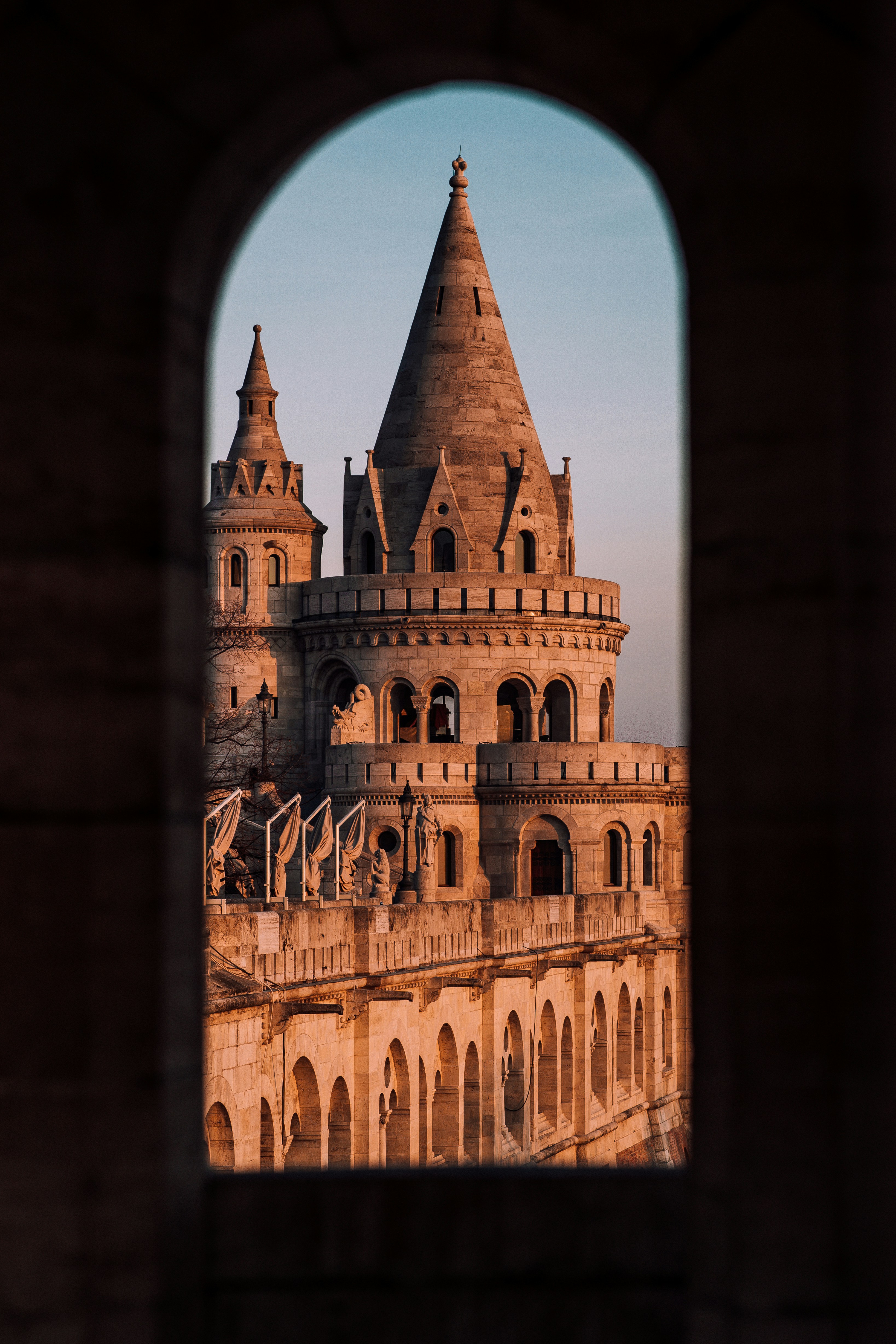 Ottoman towers through a narrow archway at sunset