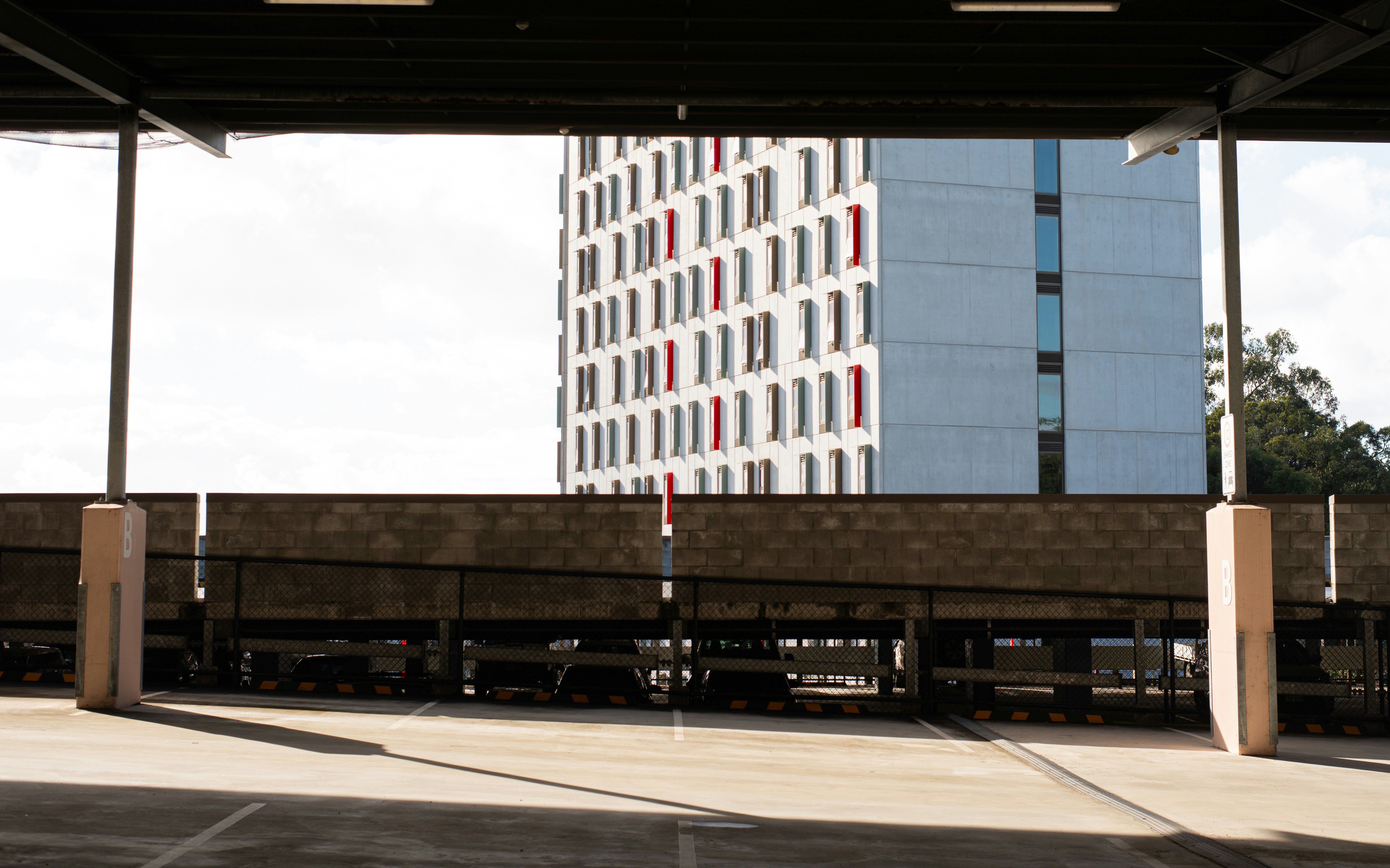 Shadowed Parking Deck Framing a Modern Atrium