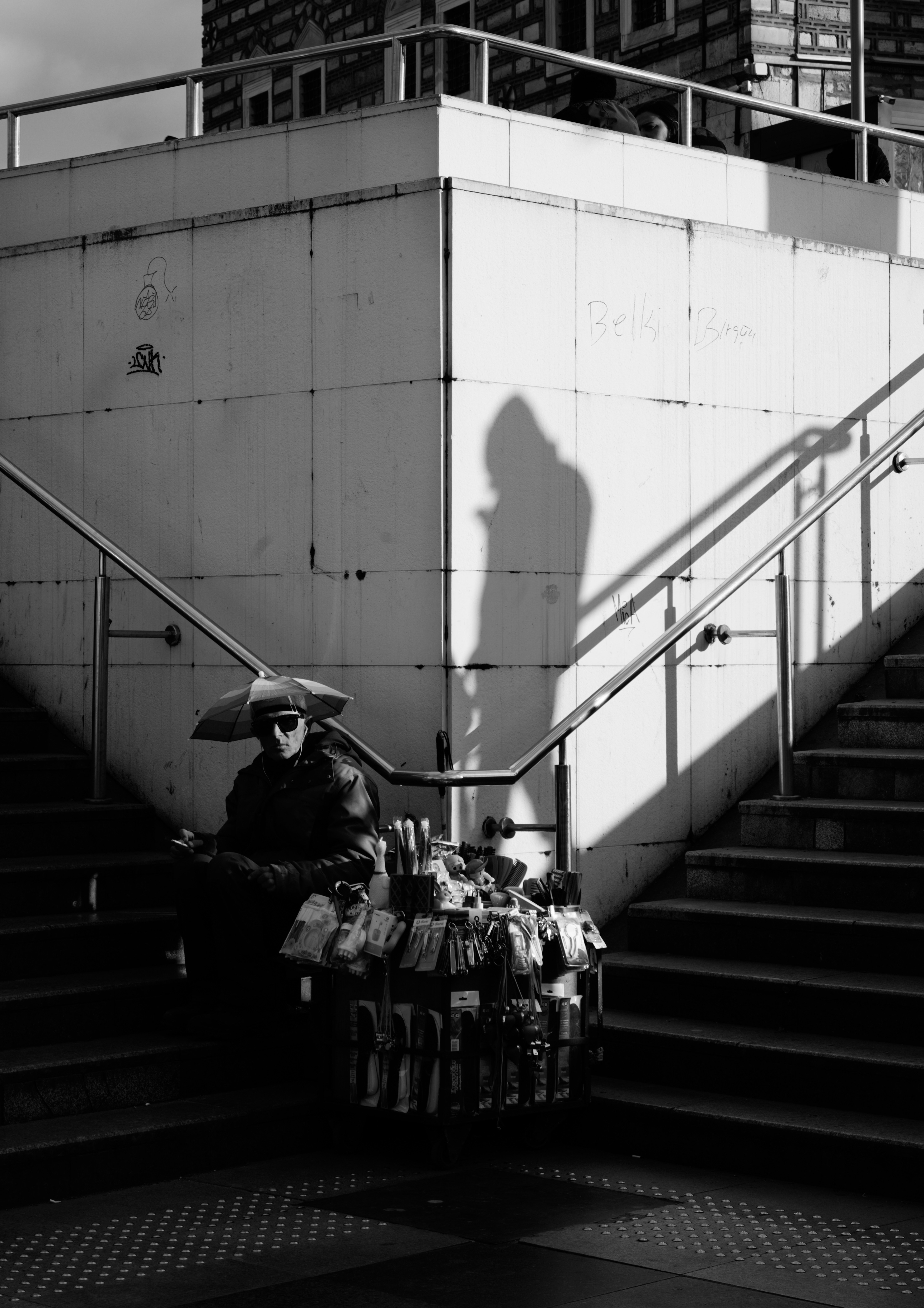 Street Vendor at Twilight: Shadow of the Escalator