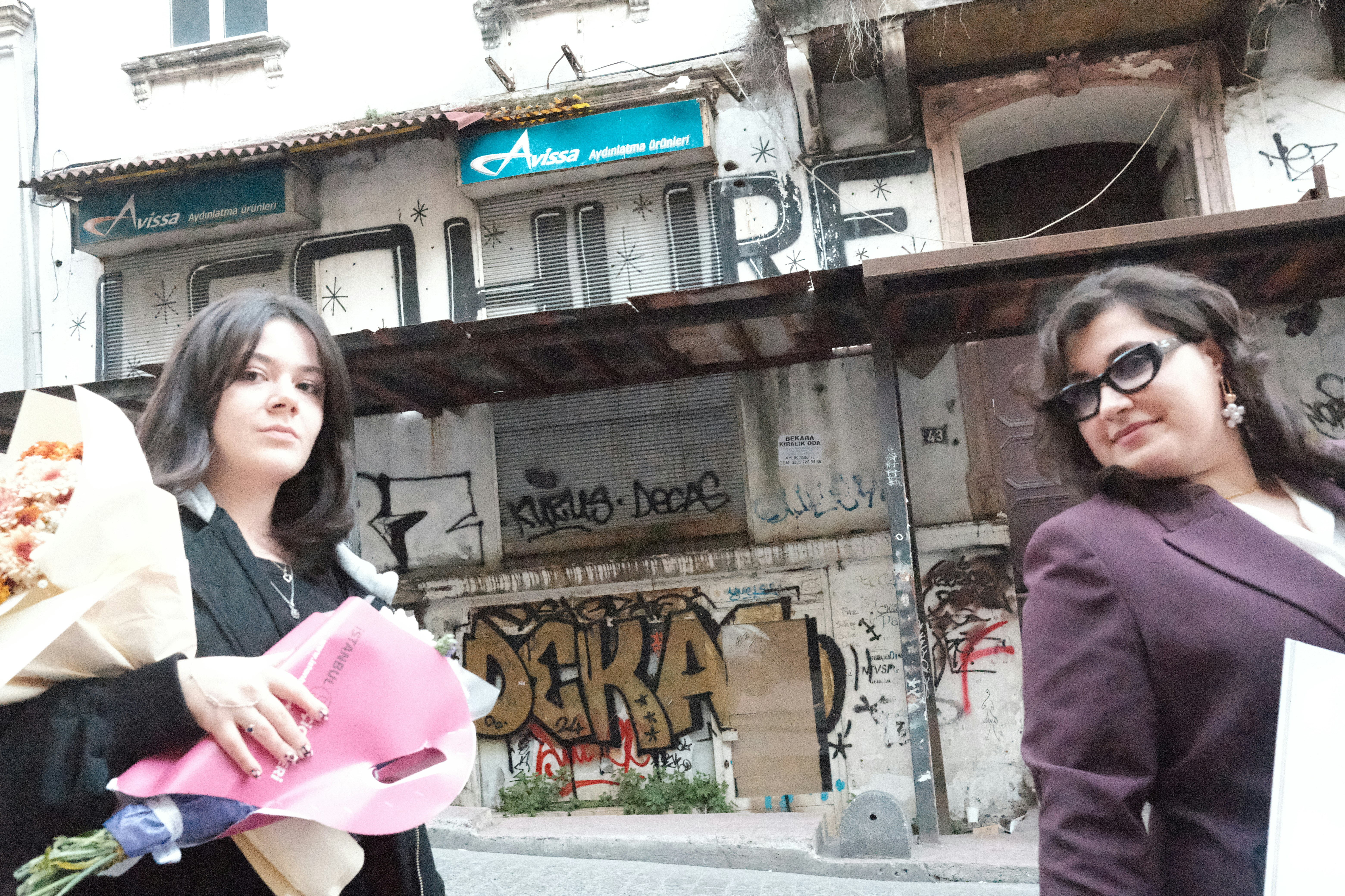 Two Women in an Urban Graffiti Scene