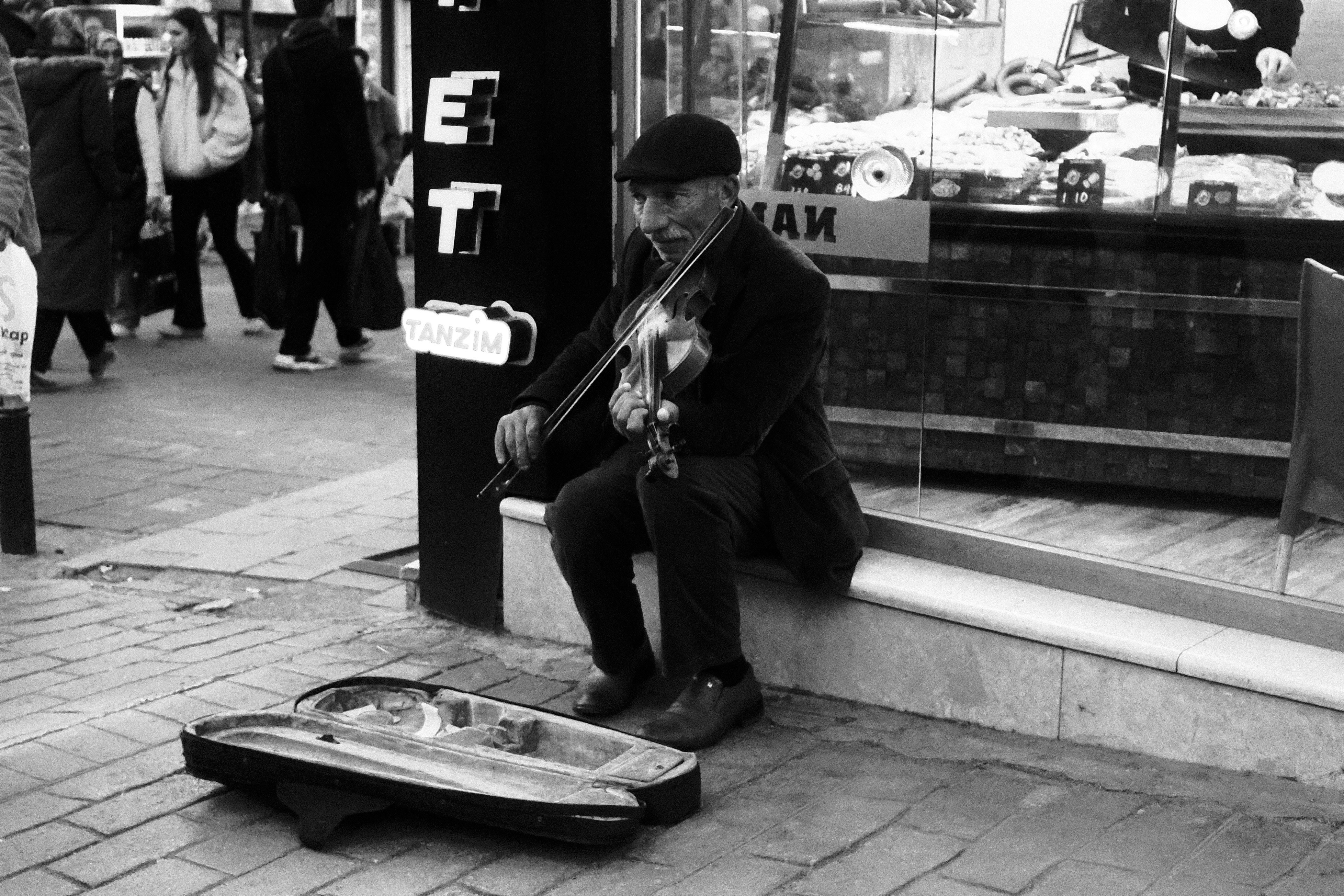Violin in the City: Street Musician on a Bench