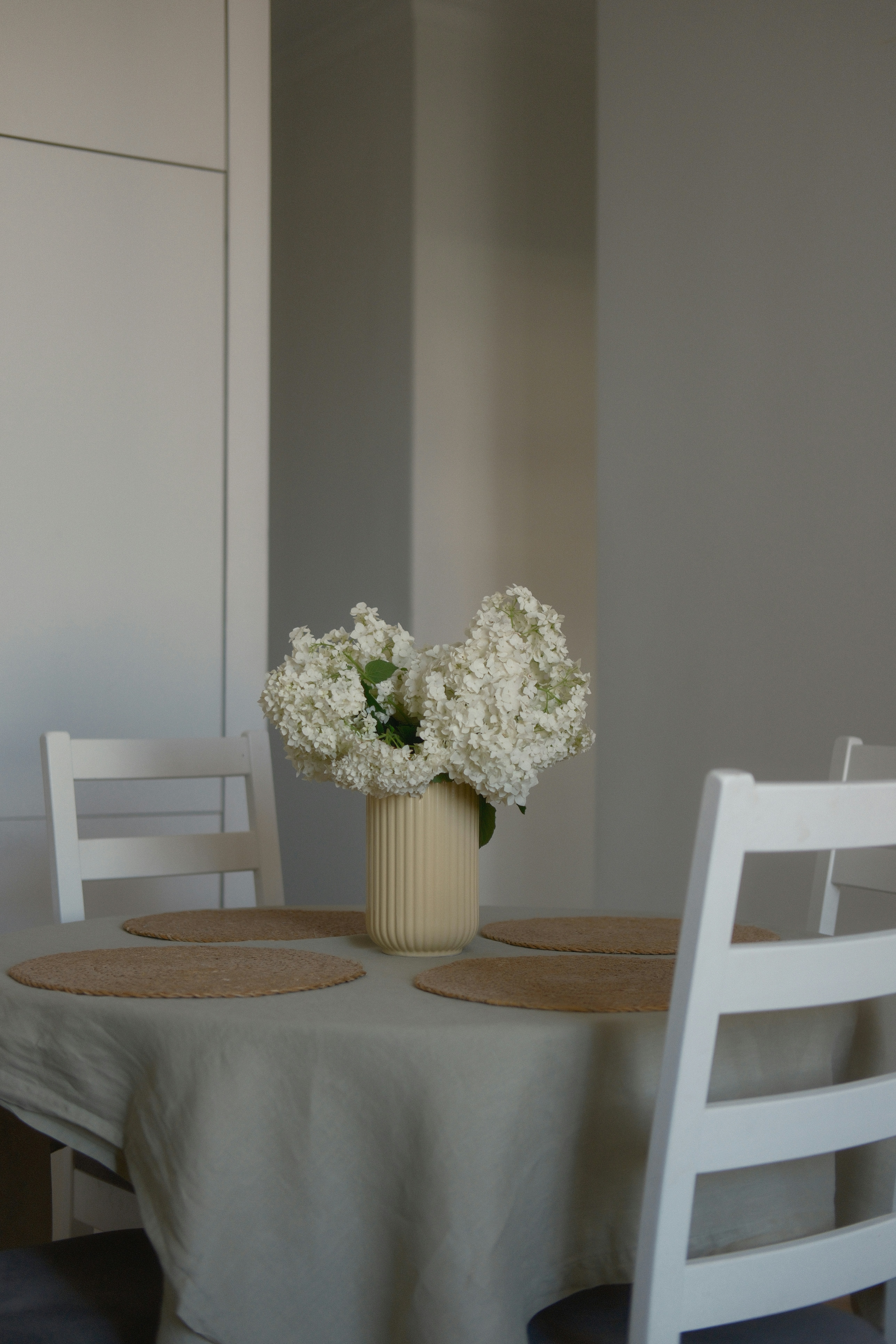 White Hydrangeas in a Quiet Kitchen Dining Scene