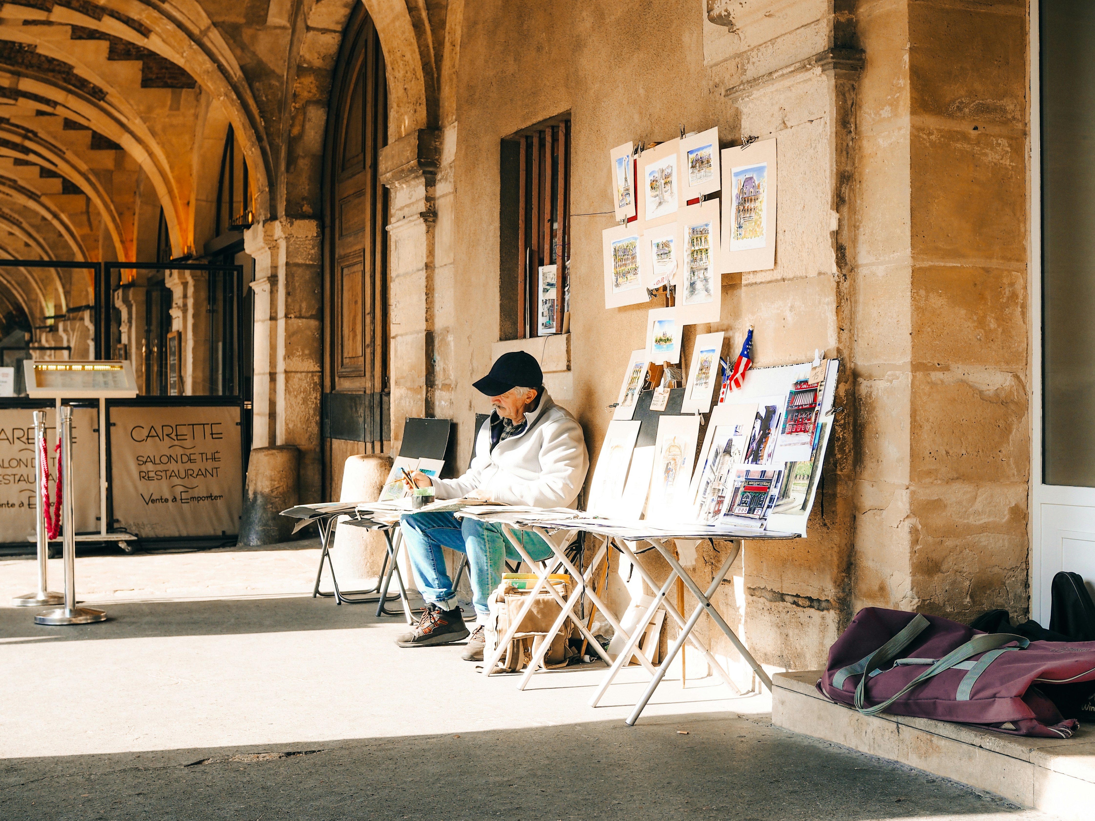 Street-side Artist Stall under Arched Arcade